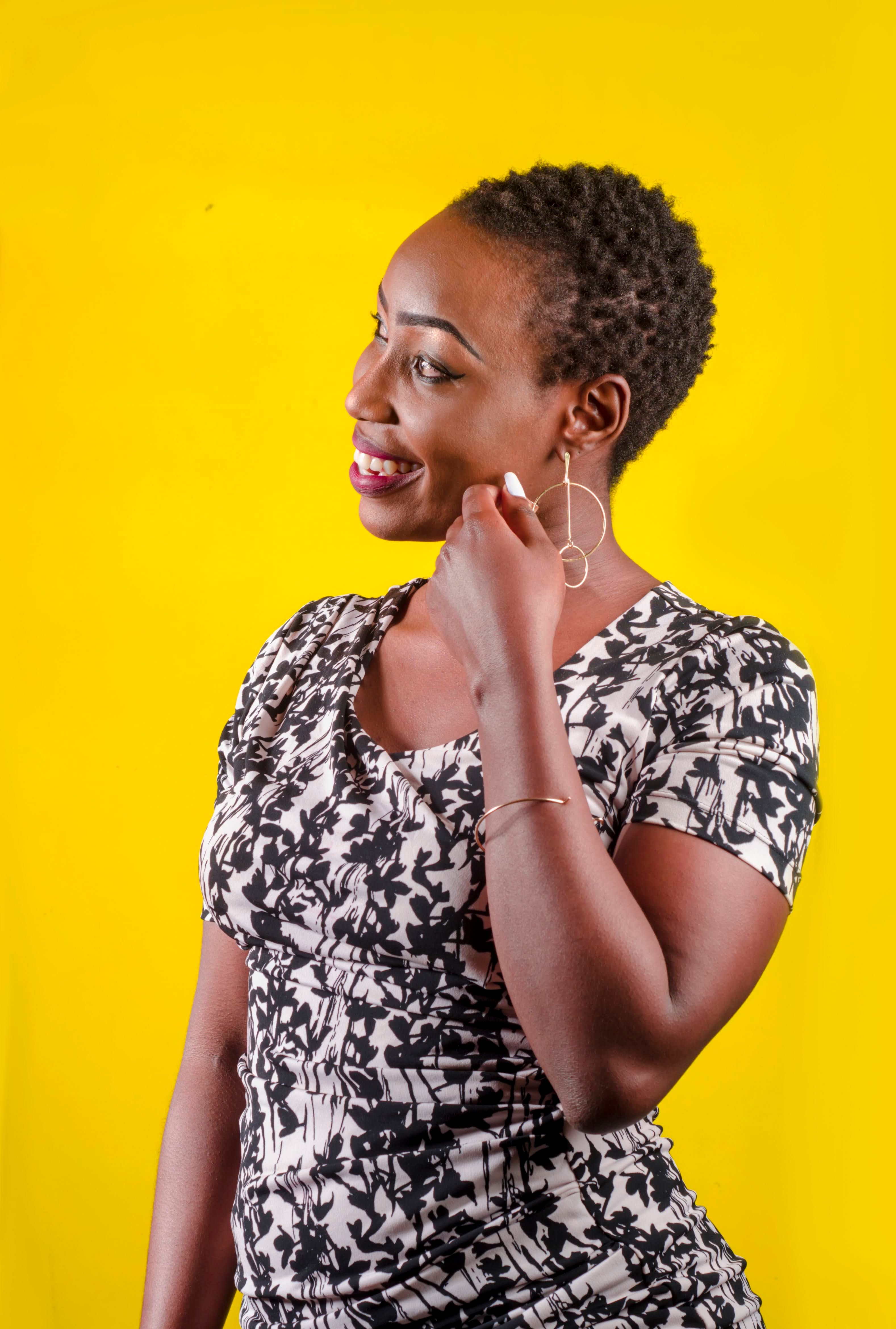 Portrait of a Woman on a Yellow Background · Free Stock Photo