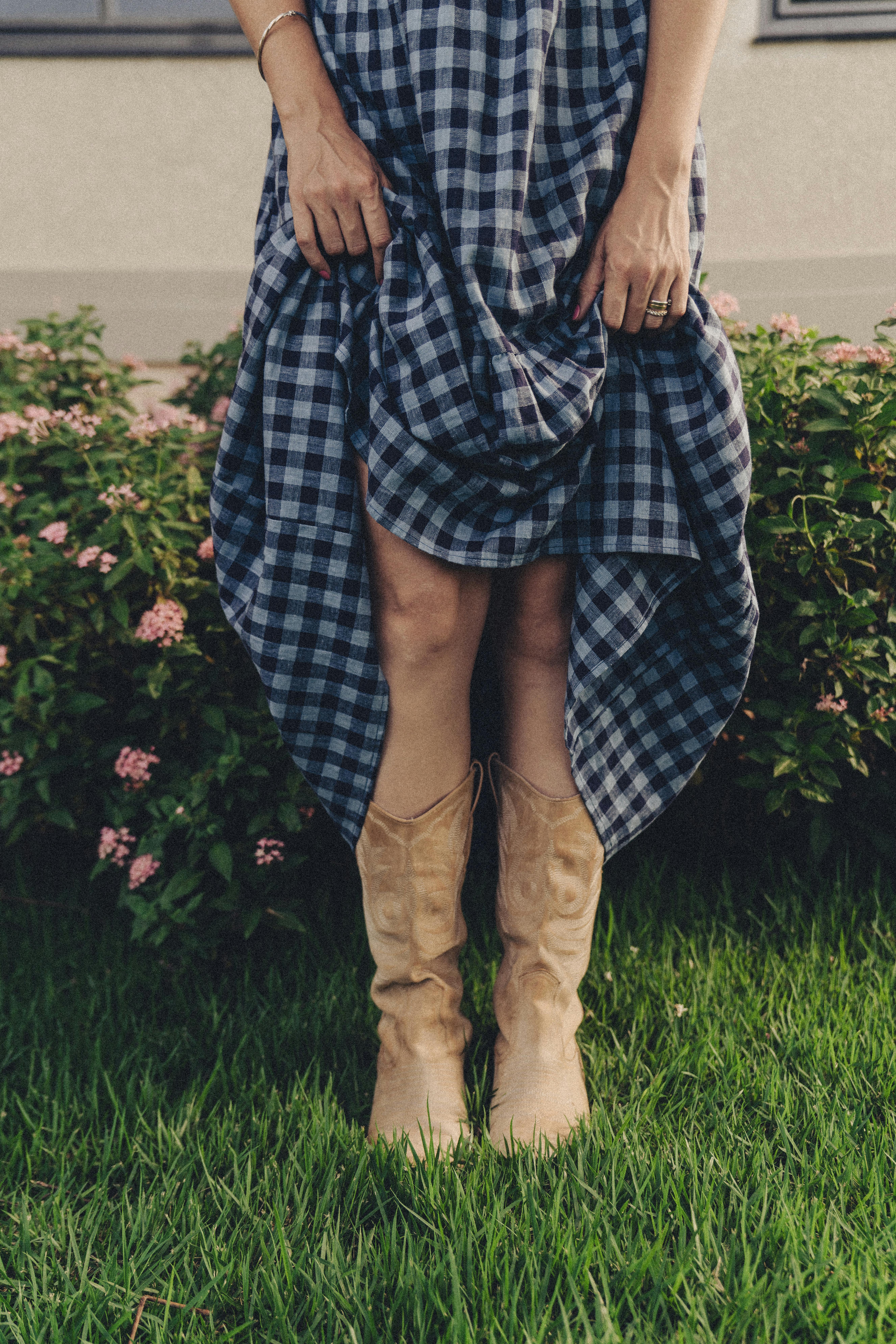 Photo of a Woman Wearing a Checkered Maxi Dress and Brown Boots · Free ...