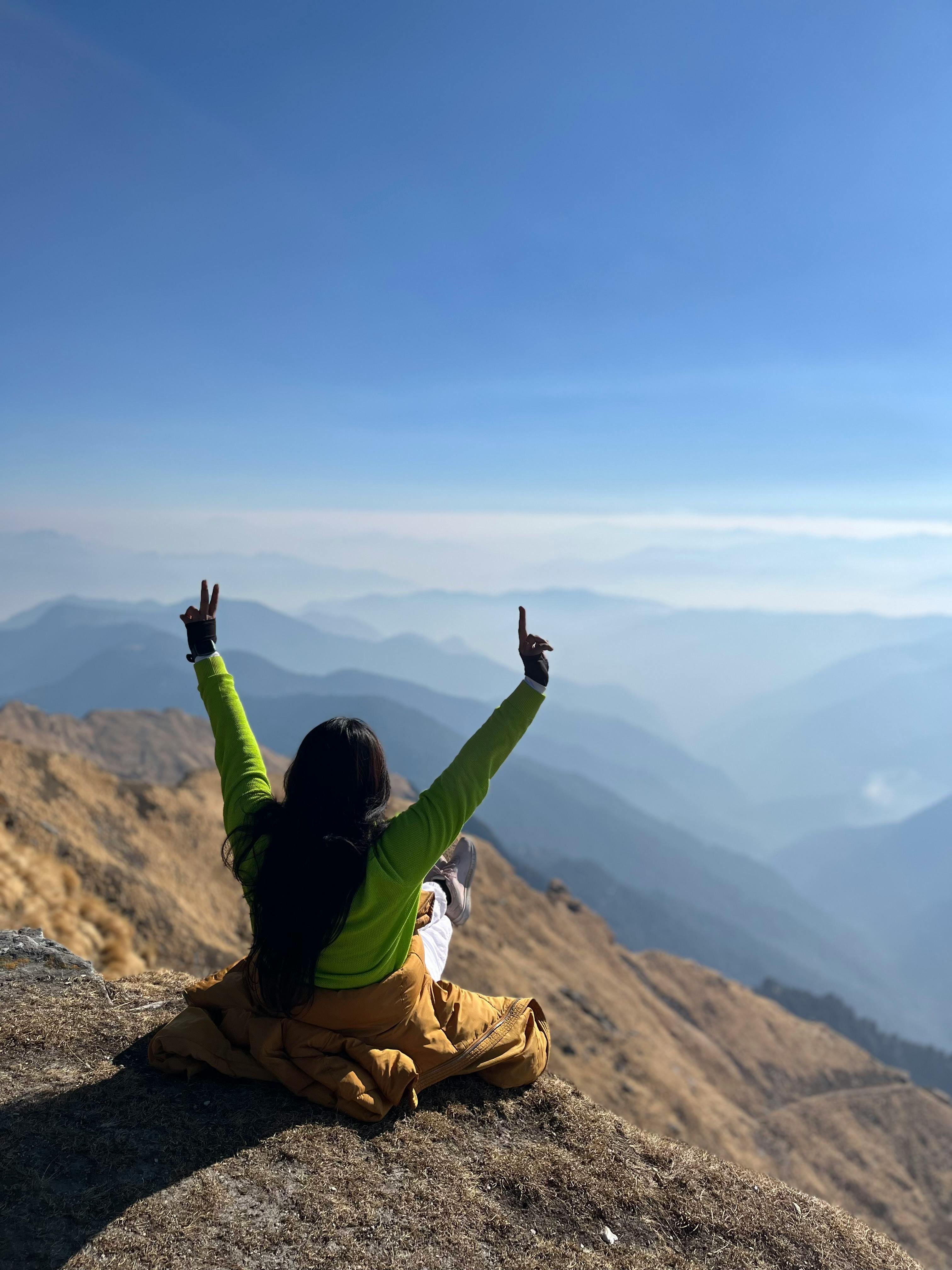 Hiker Sitting on Mountain Top · Free Stock Photo