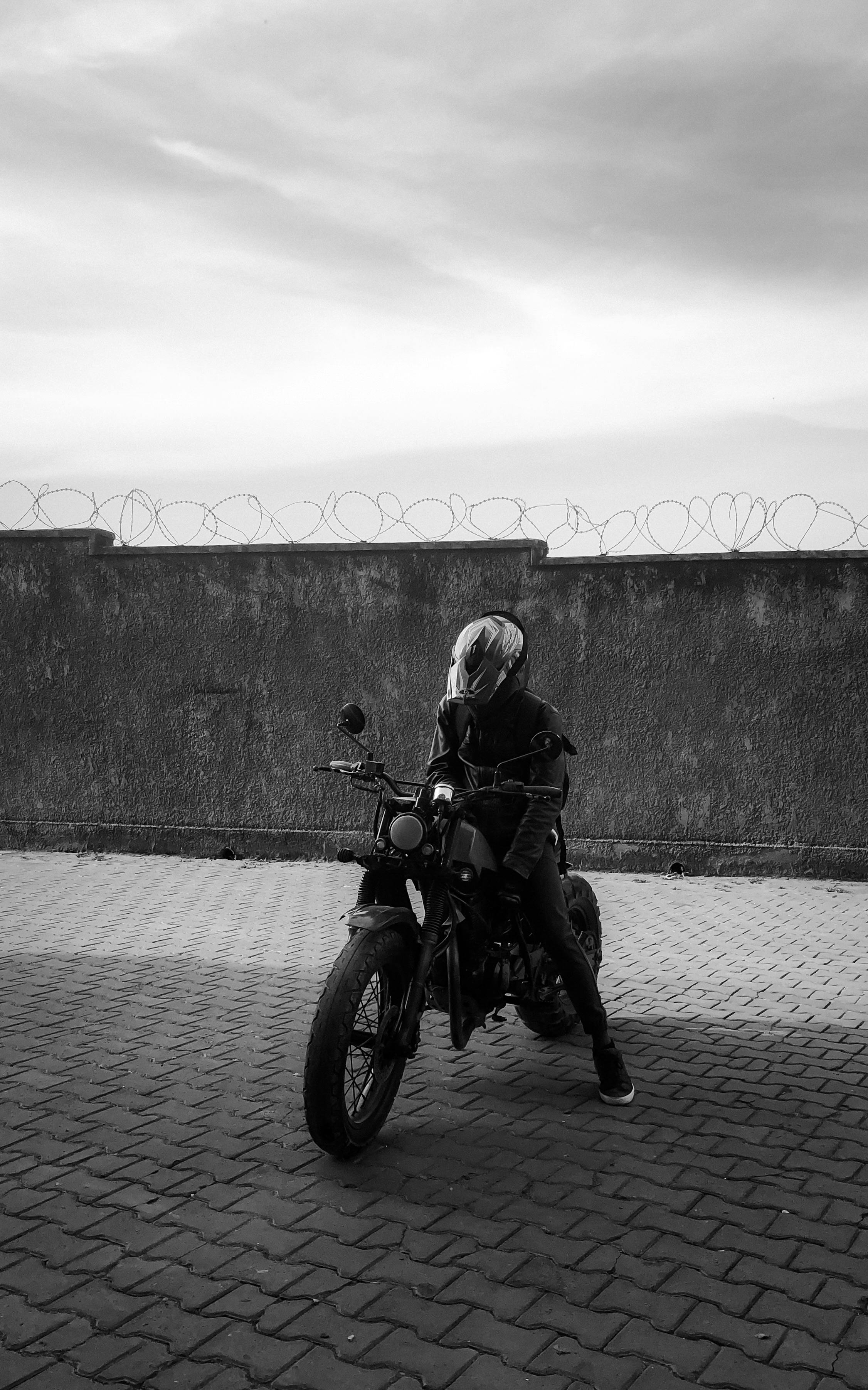 Biker on a Motocross Motorcycle Near a Barbed Wire Fence Wall · Free ...