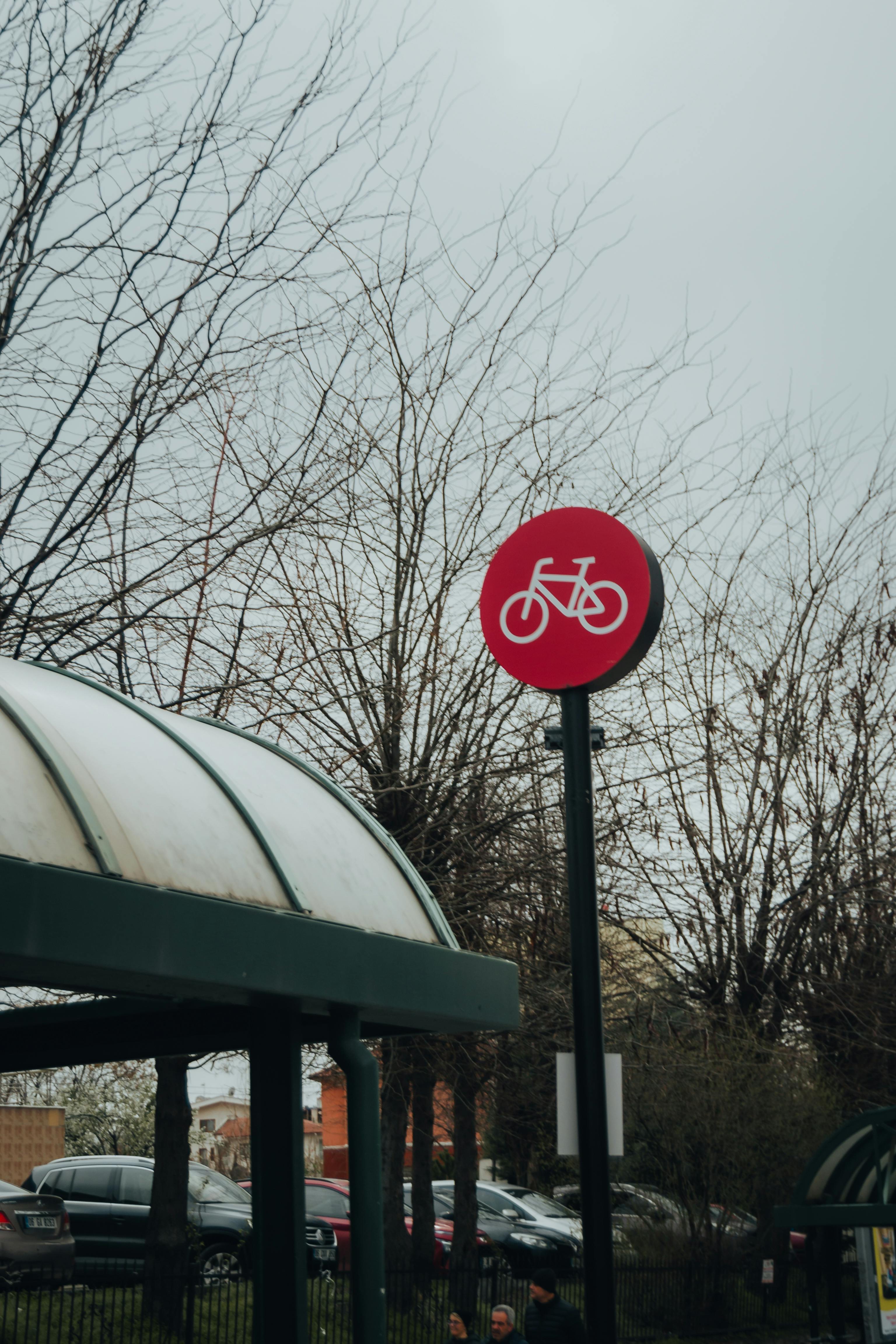 Red Bicycle Road Sign in a City · Free Stock Photo