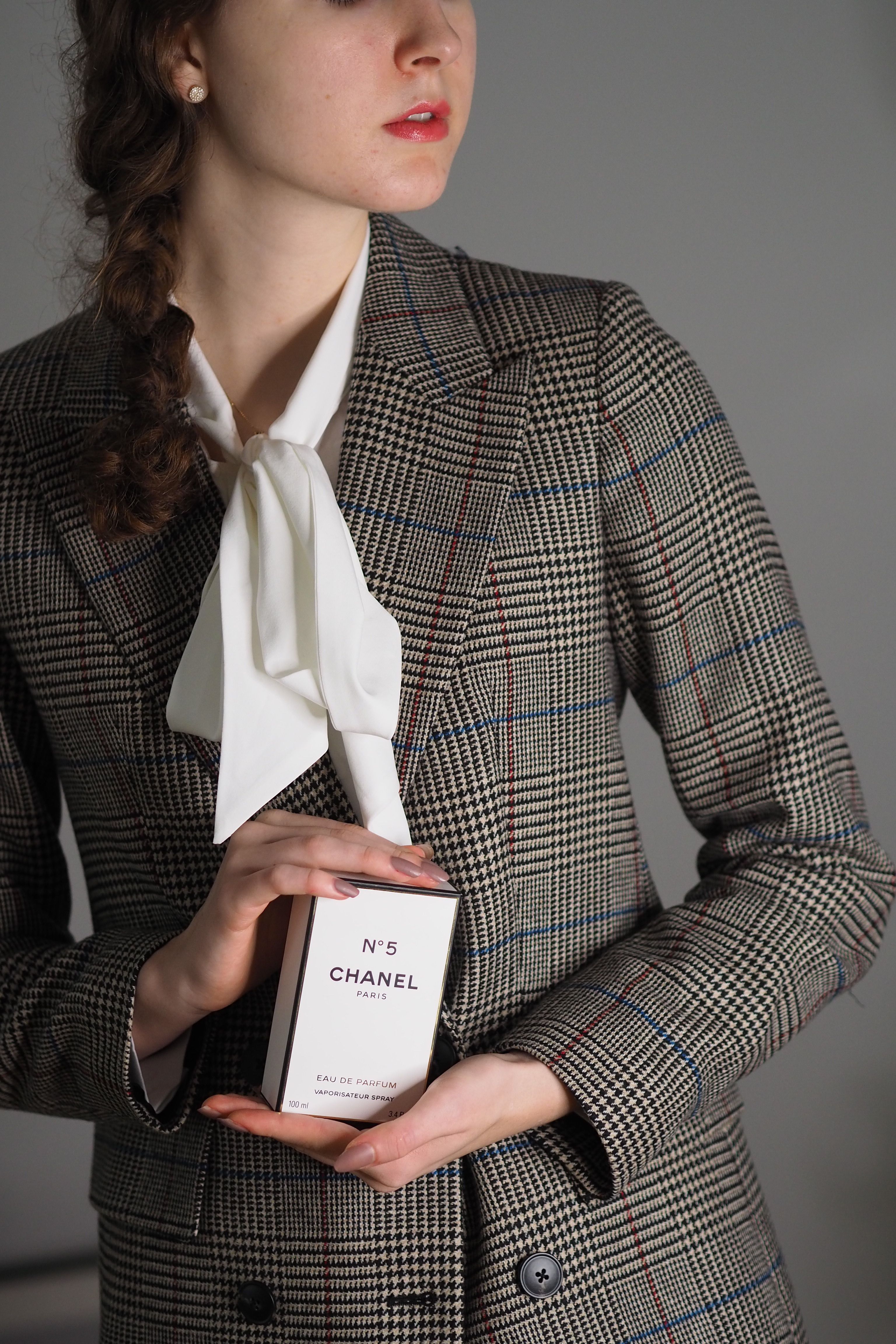 Woman in Windowpane Jacket Holding Box of Perfume · Free Stock Photo