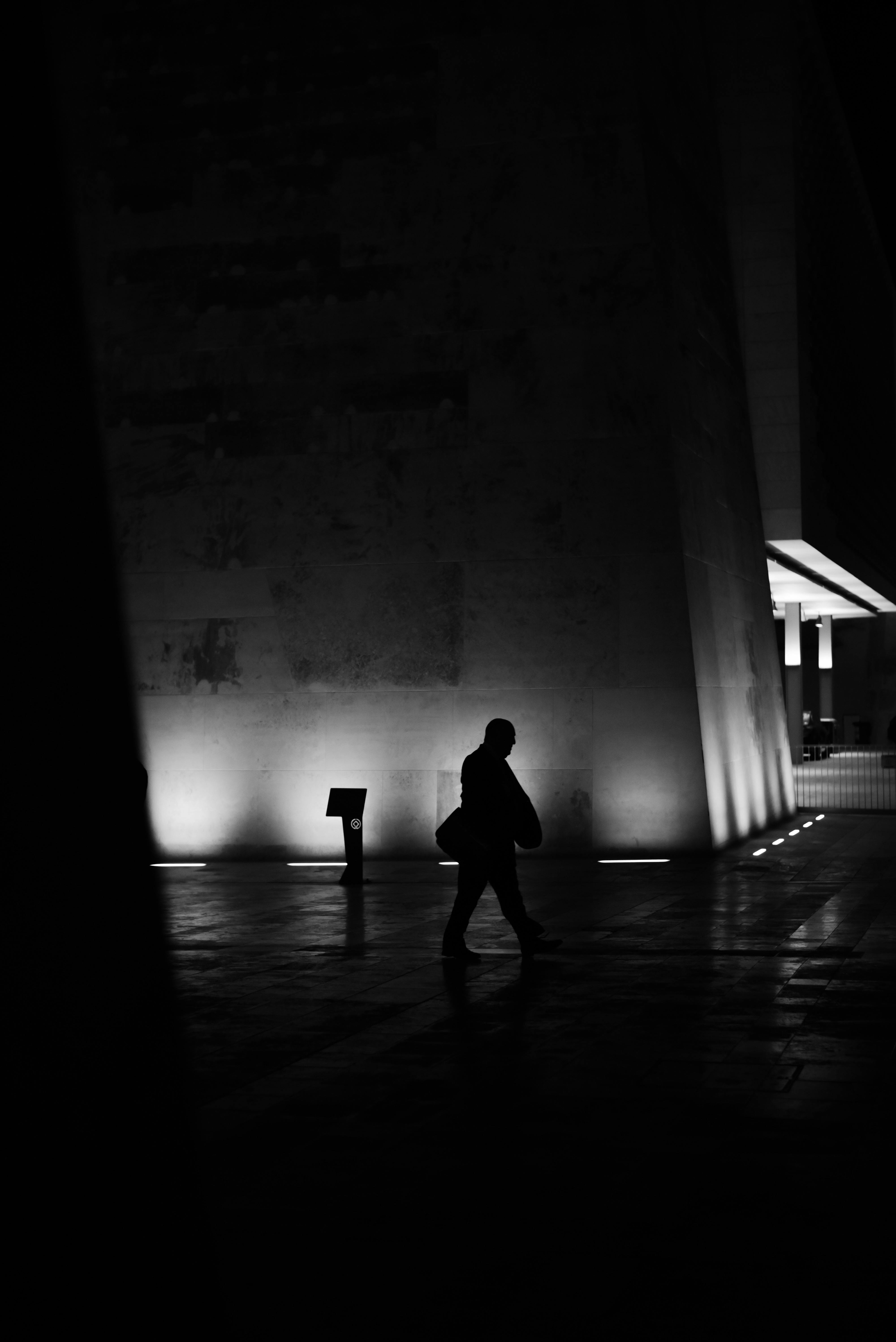 Silhouette of Walking Man in Darkness · Free Stock Photo