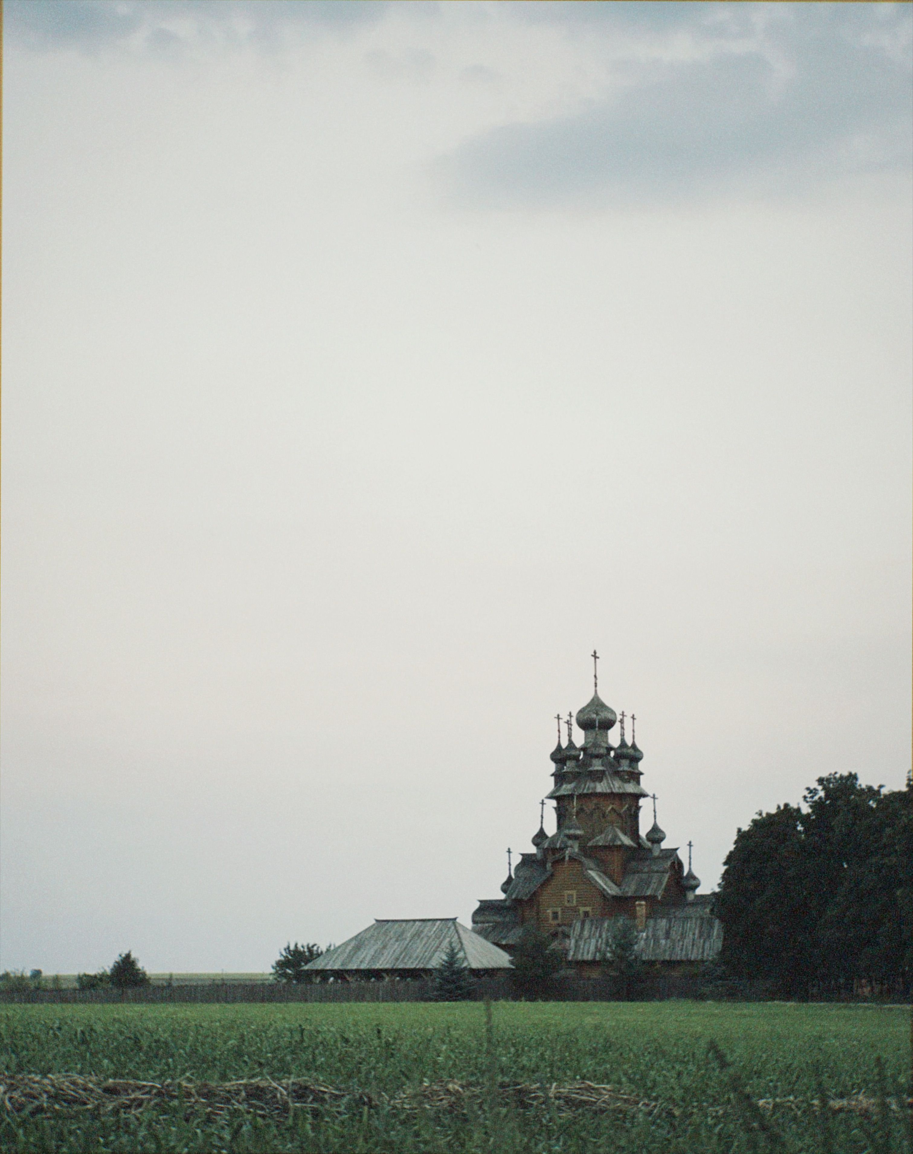 A photo of a church in a field · Free Stock Photo