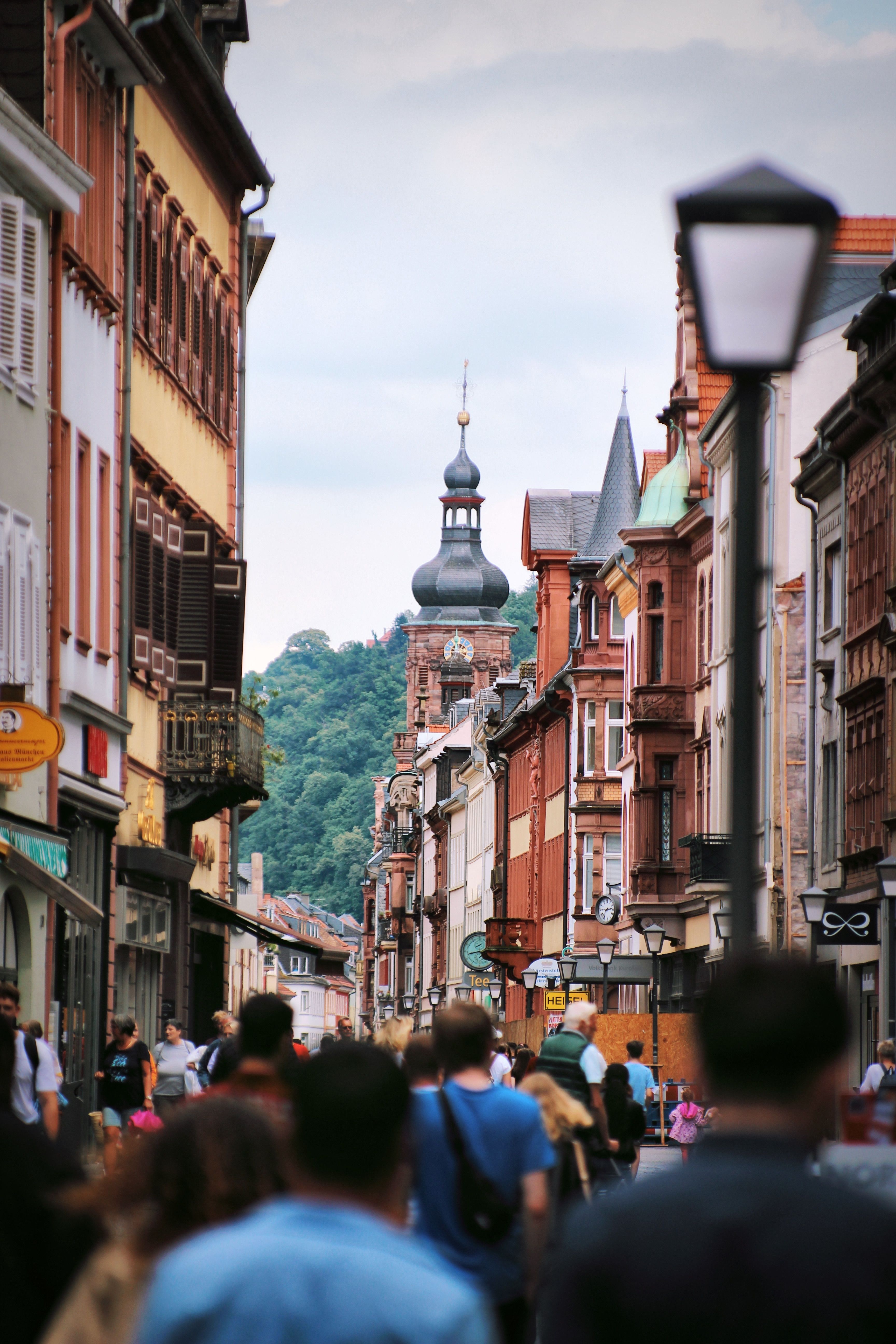 People walking down a street in a city · Free Stock Photo