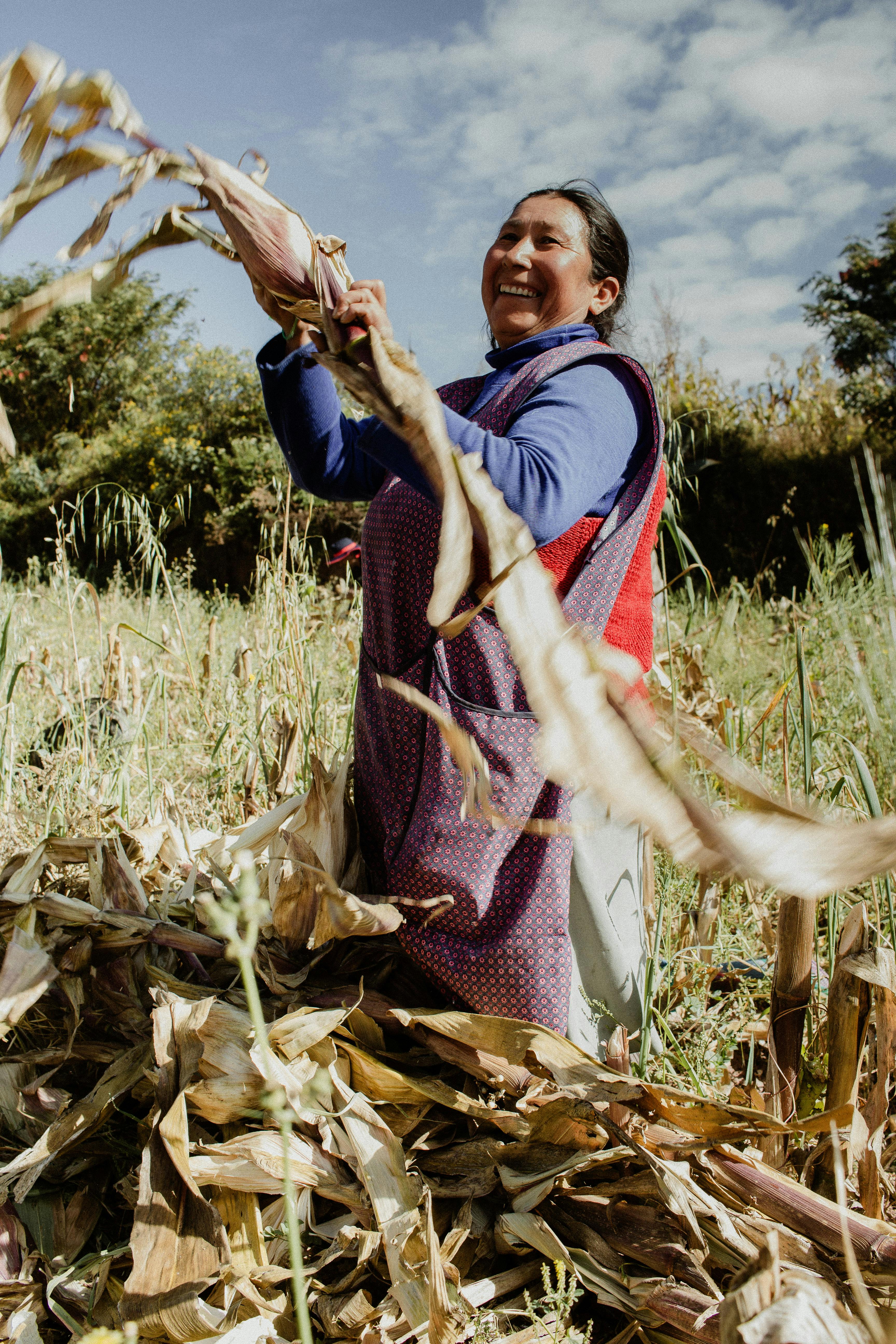 Smiling Woman on Rural Field · Free Stock Photo