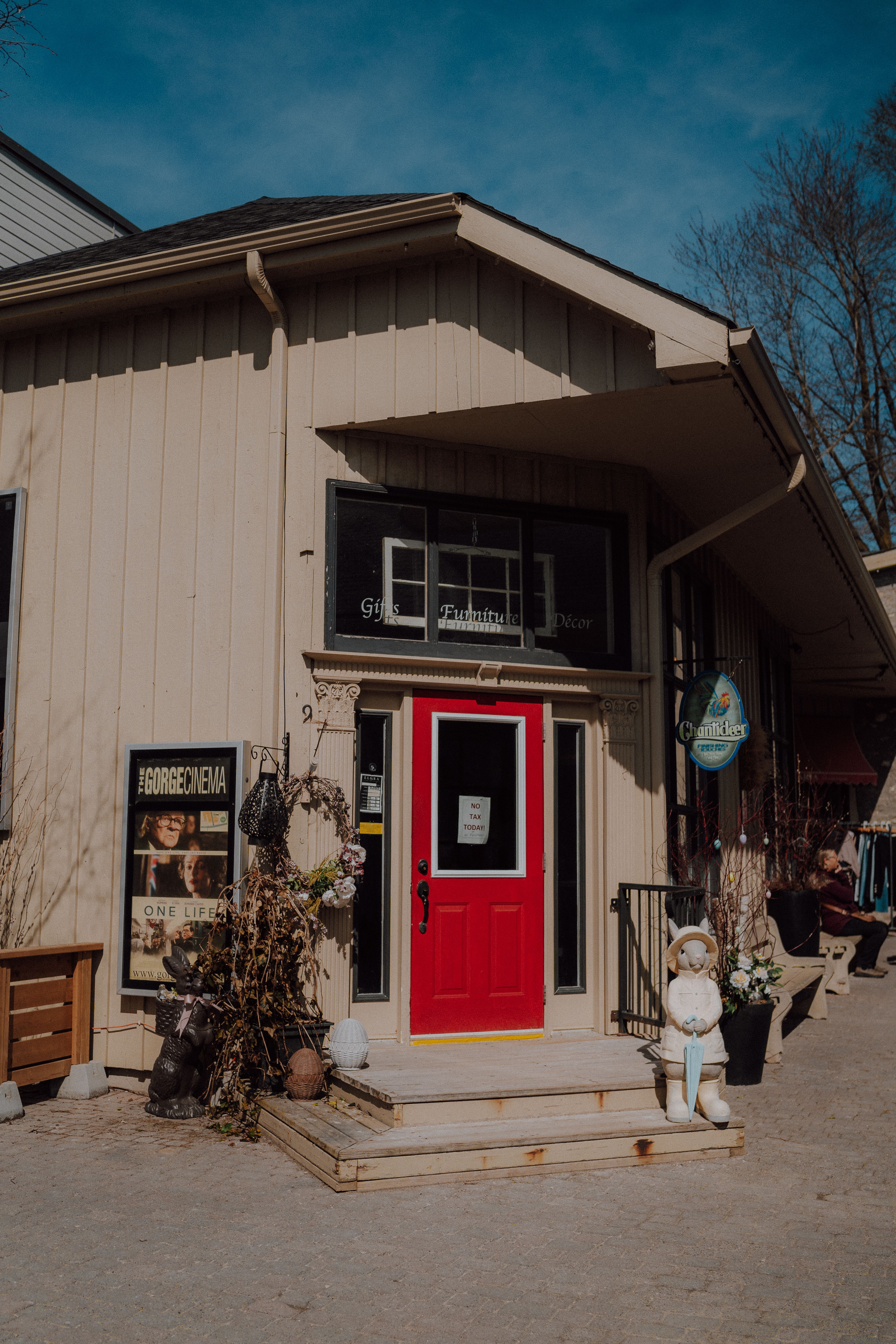 A red door with a sign that says, the shop · Free Stock Photo