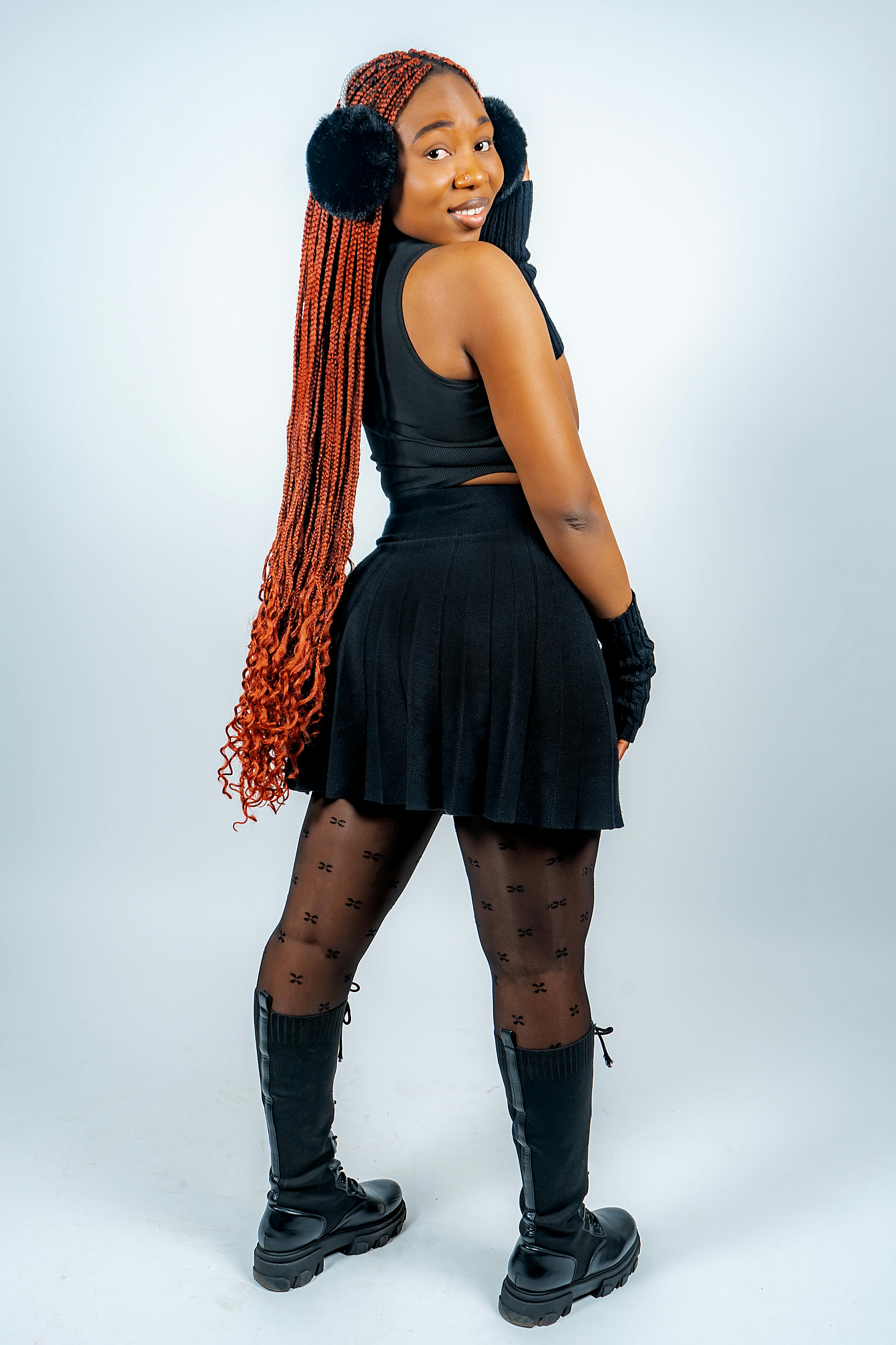 A woman with red hair and black boots · Free Stock Photo