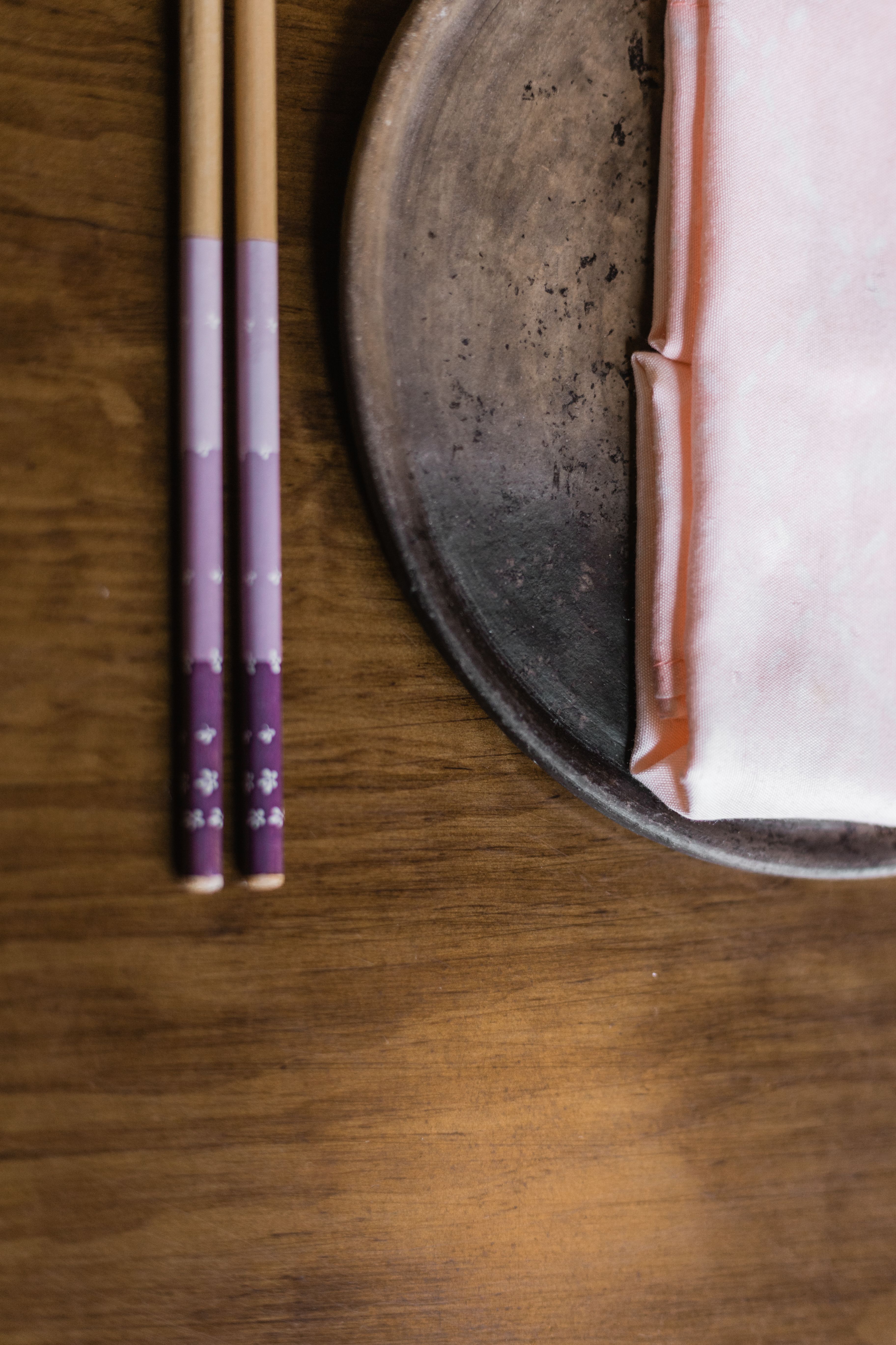 Close-up of Chopsticks and a Plate on a Table · Free Stock Photo