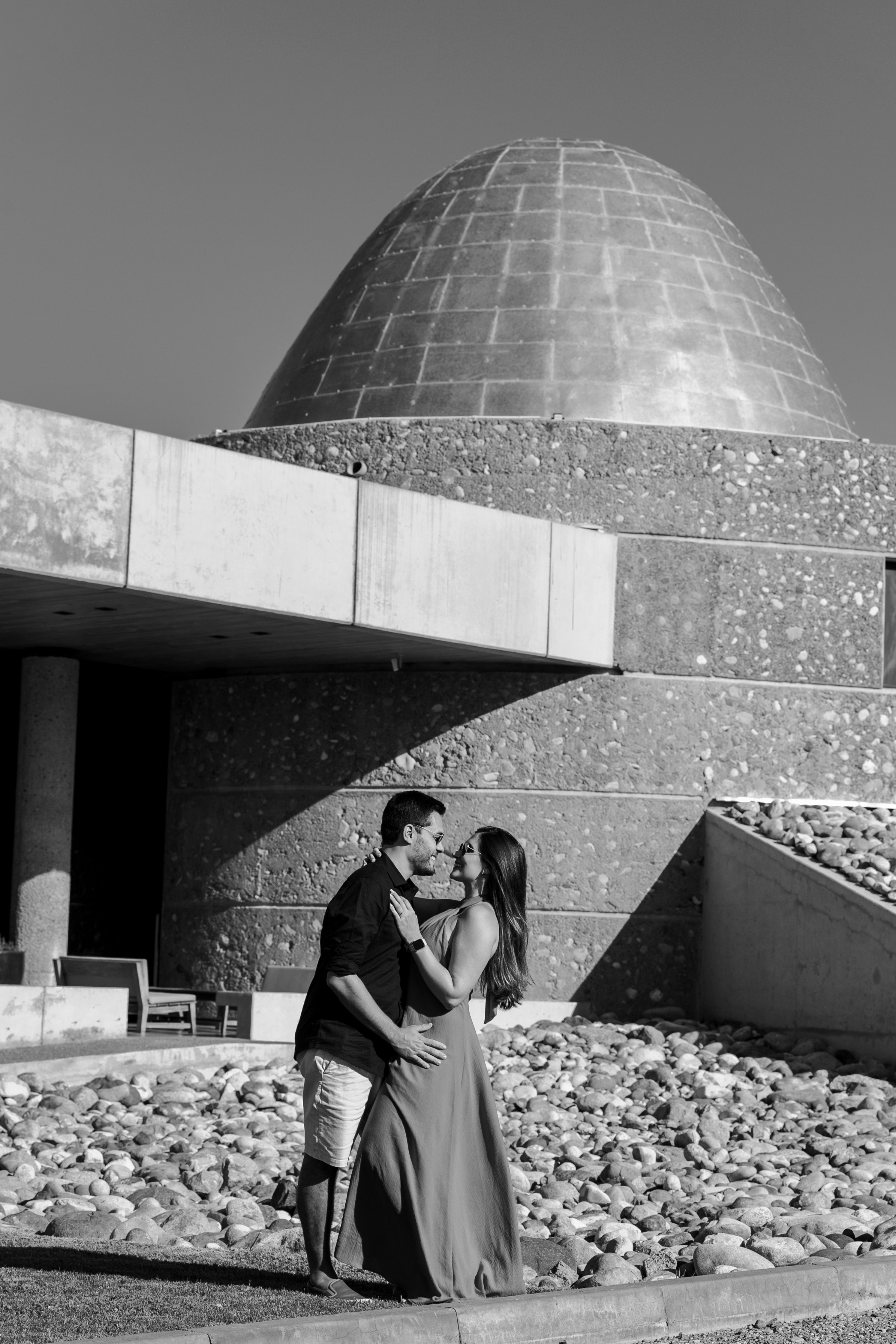 Couple Hugging near Building · Free Stock Photo