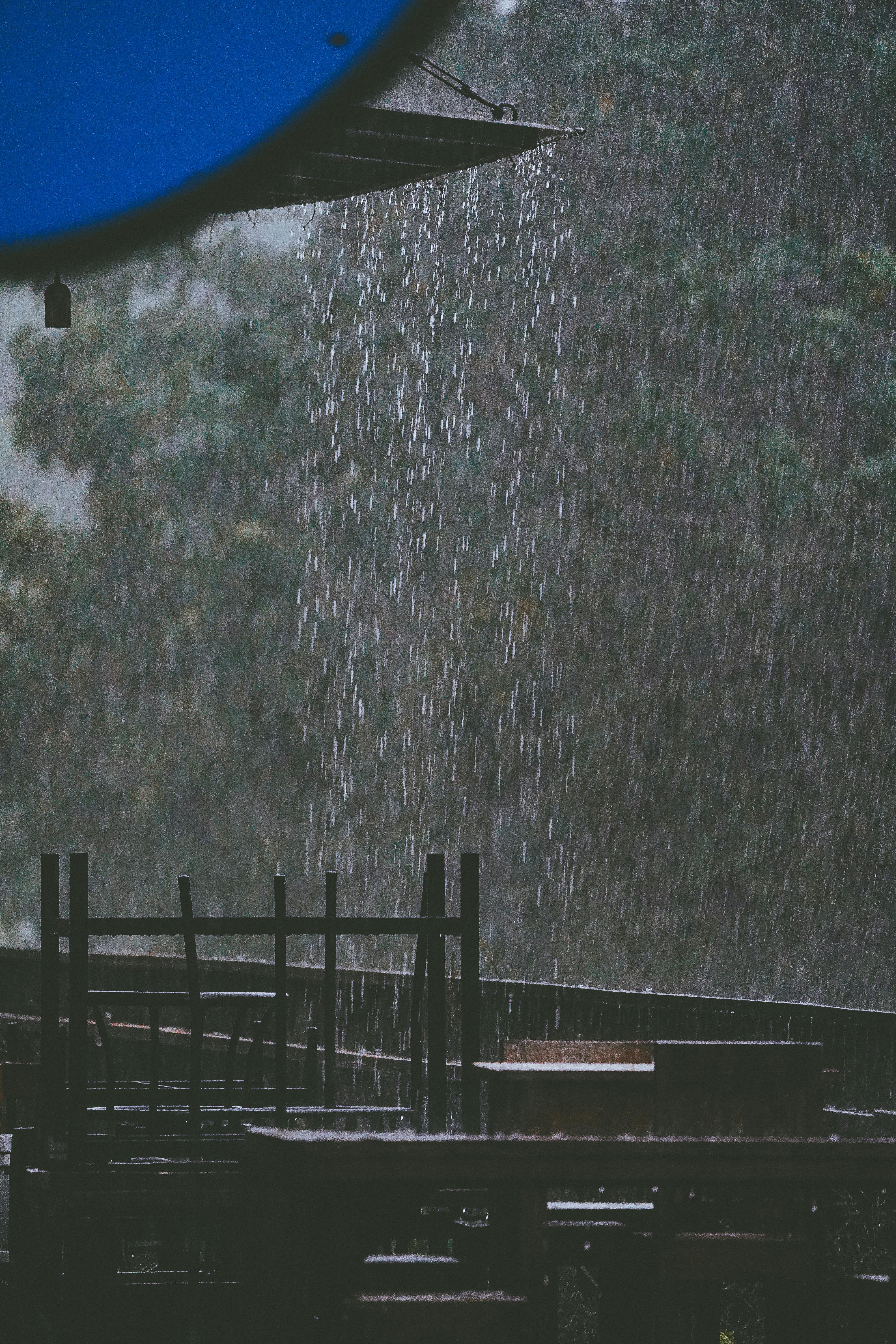 Rain Falling From Rroof onto Terrace · Free Stock Photo