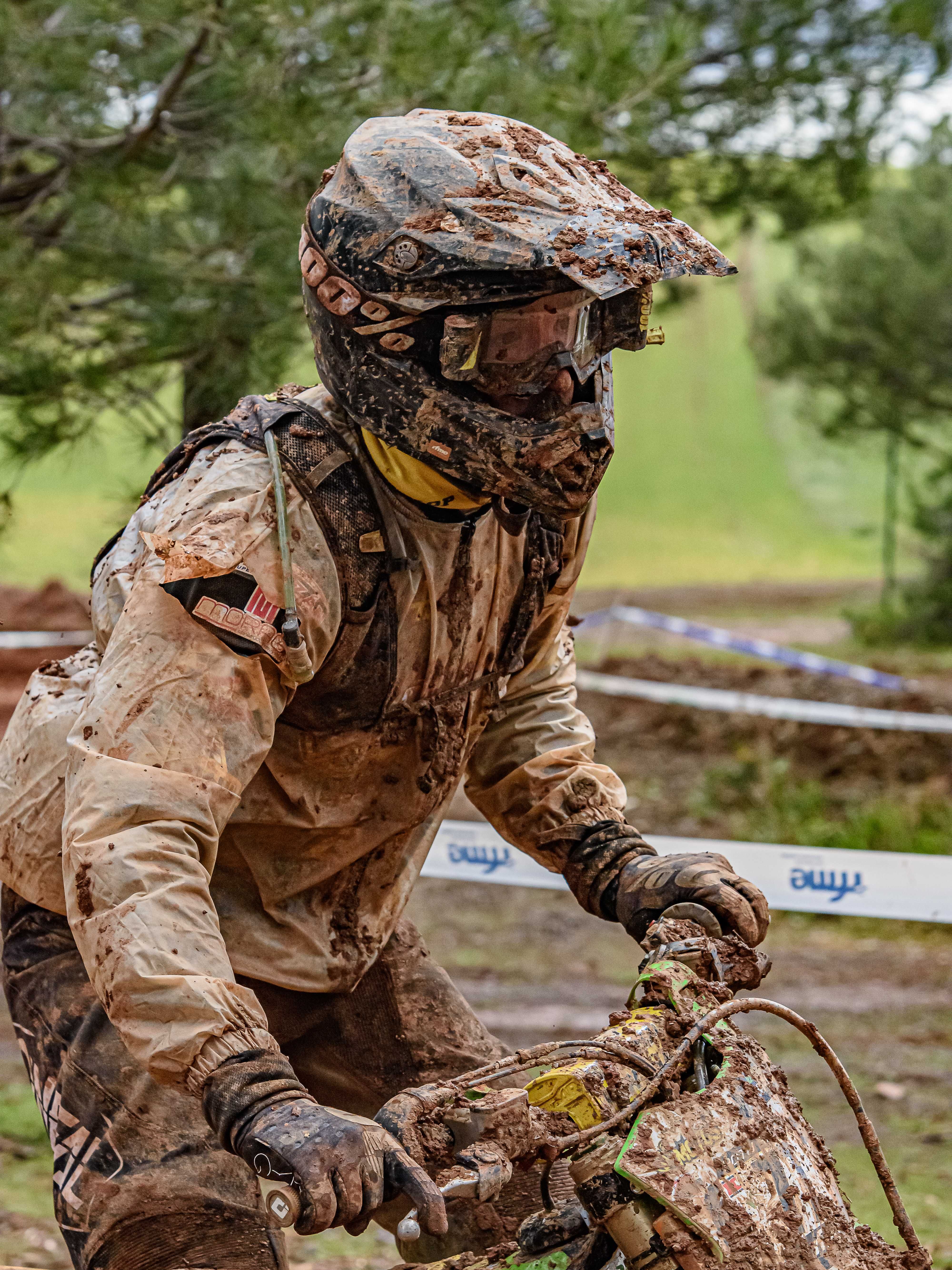 Mud-covered Man Riding on a Motocross Track · Free Stock Photo