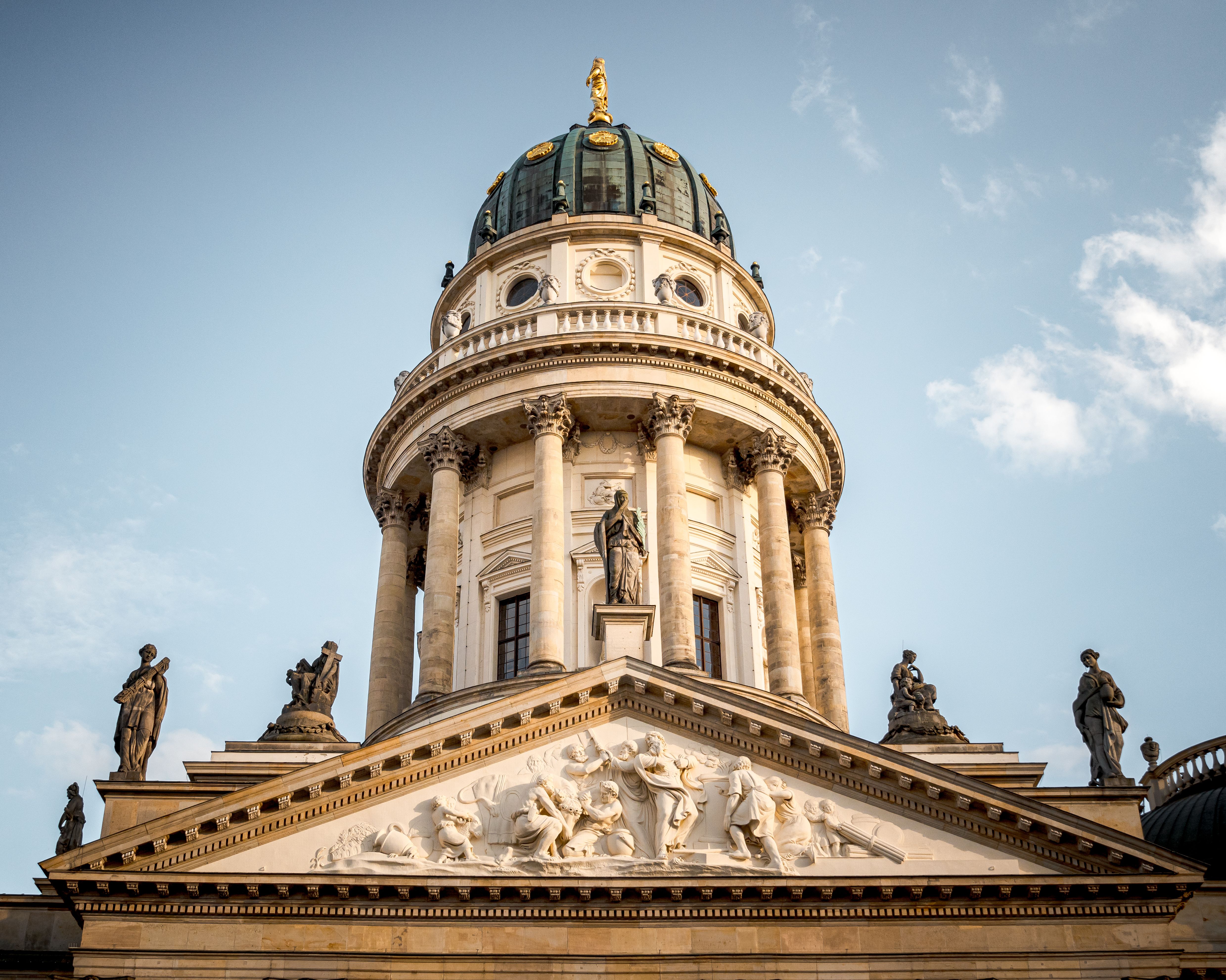 The top of a building with statues on it · Free Stock Photo