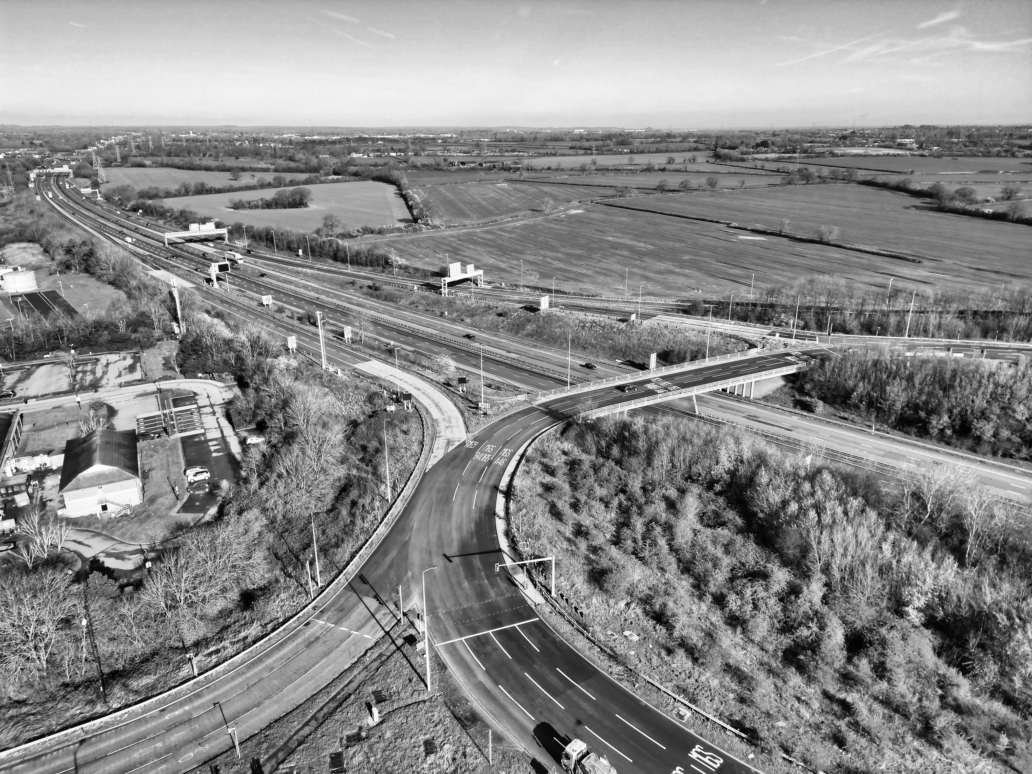 Aerial View of Highway Intersection and Fields · Free Stock Photo