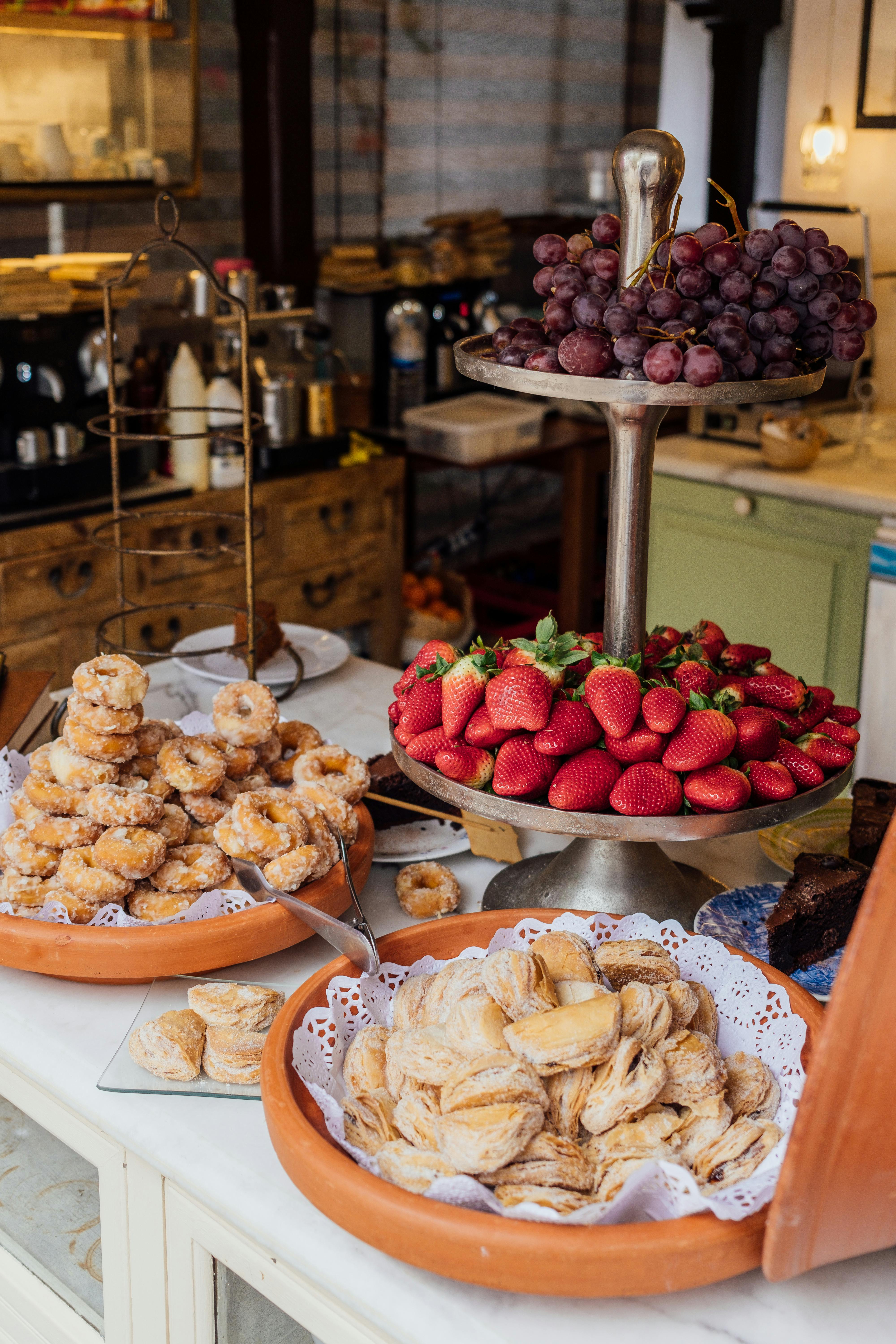 A table with a variety of pastries and fruit · Free Stock Photo