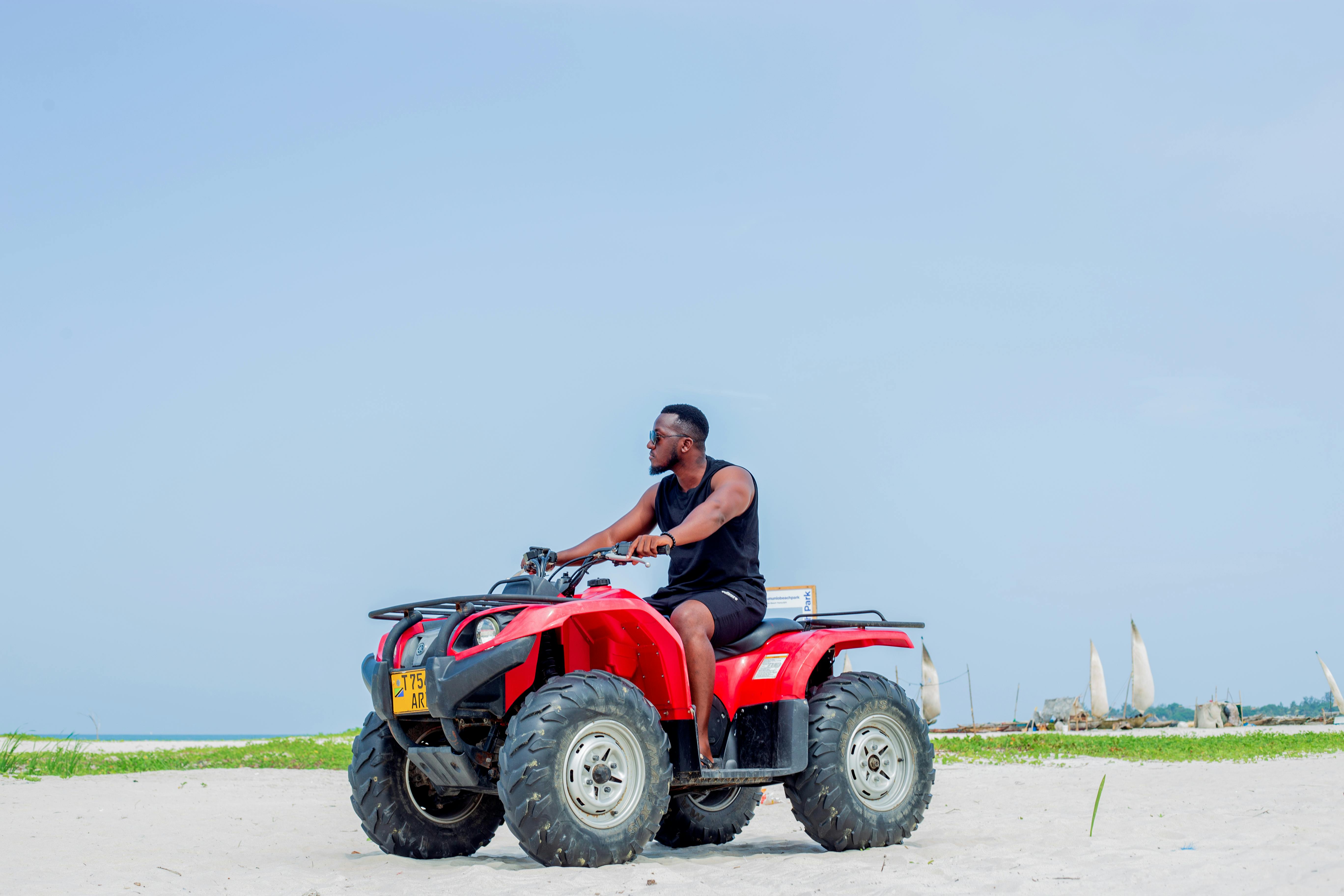 Man on Quad on Beach · Free Stock Photo