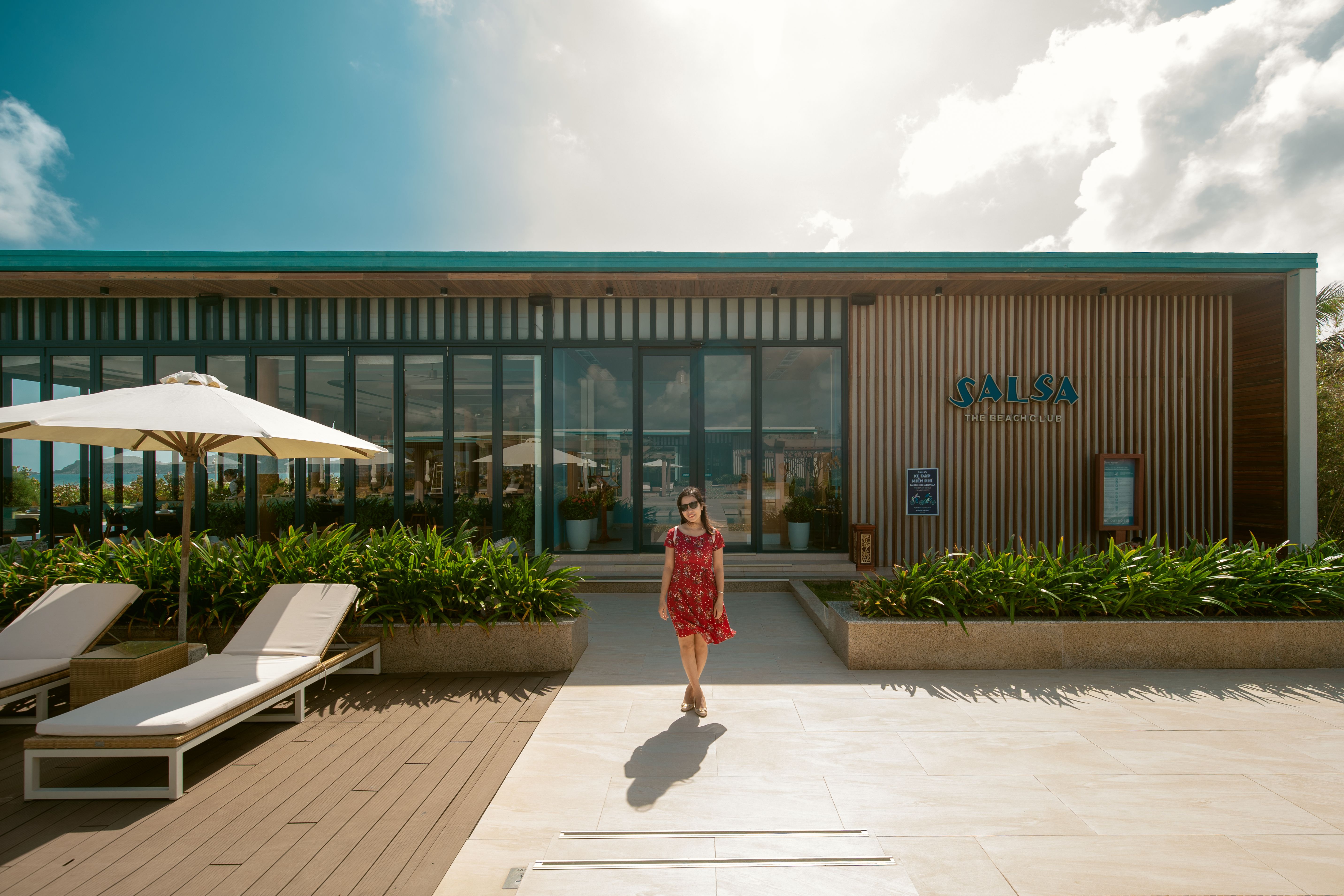Woman Standing in front of the Salsa Beach House · Free Stock Photo