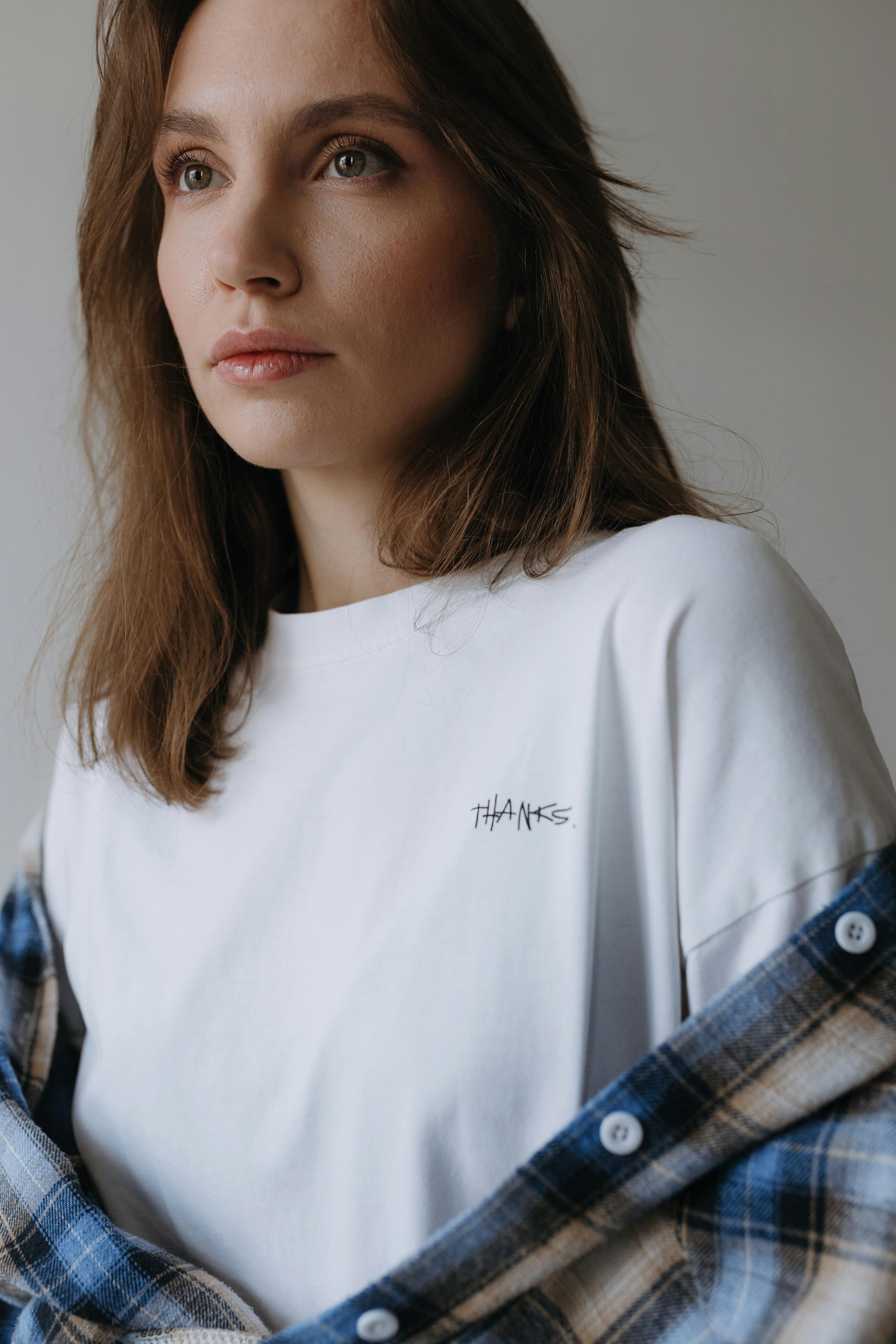 Model in a White T-shirt with a Thanks Print and a Flannel Shirt · Free ...