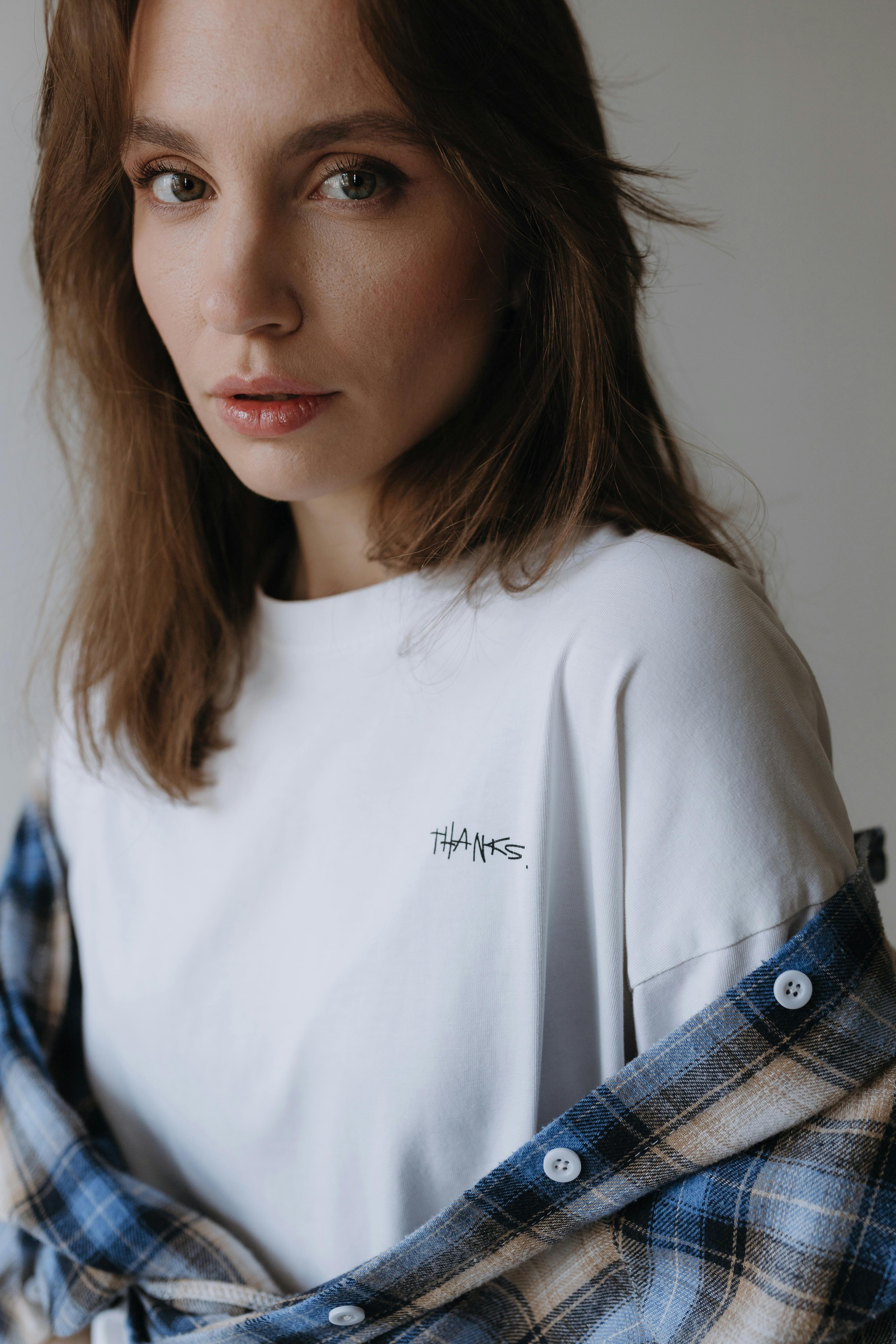 Model in a White T-shirt with a Thanks Print and a Flannel Shirt · Free ...