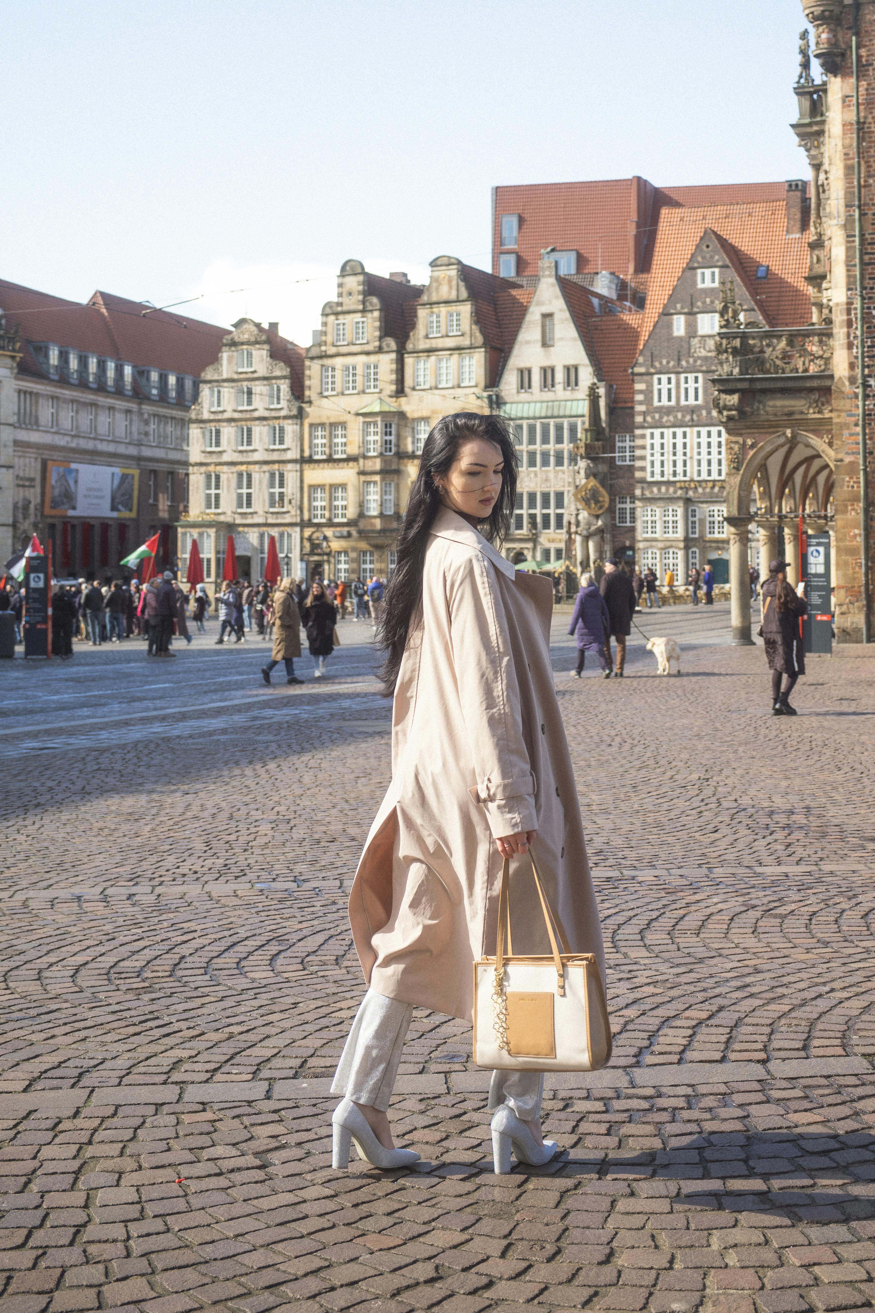 Woman Walking the Town Square · Free Stock Photo