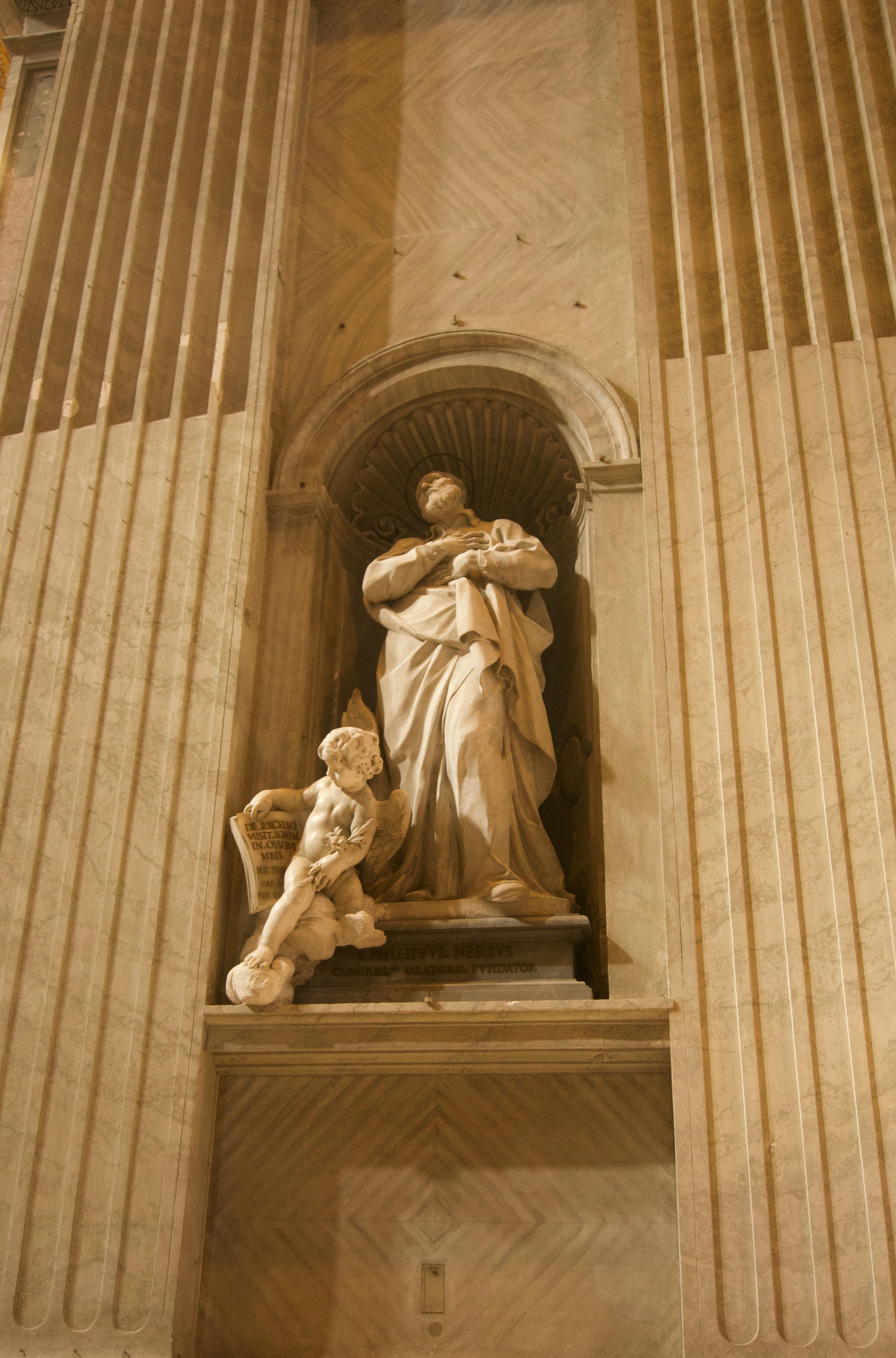 Sculpture on Building Wall · Free Stock Photo