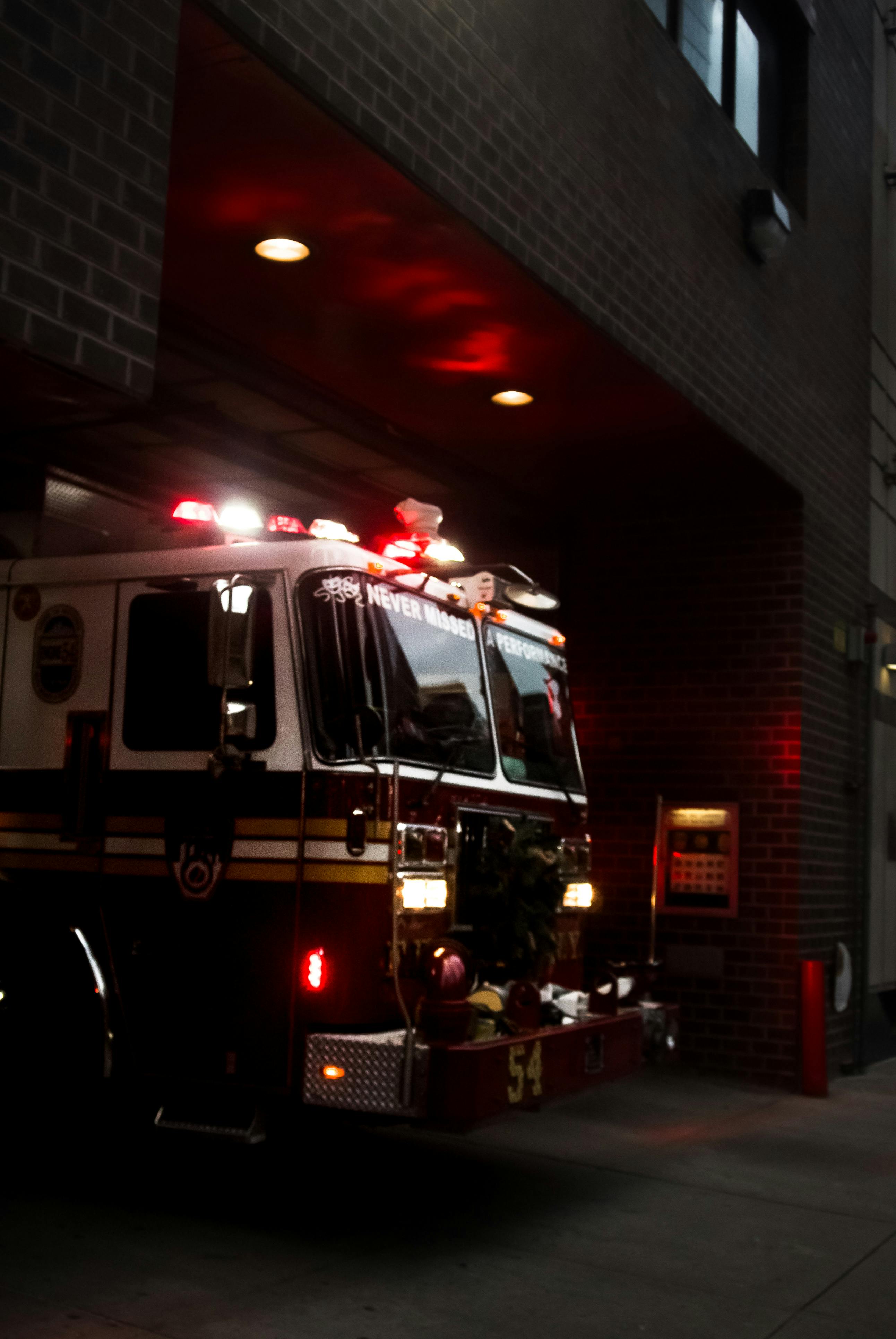 Fire Engine Leaving the Fire Station · Free Stock Photo