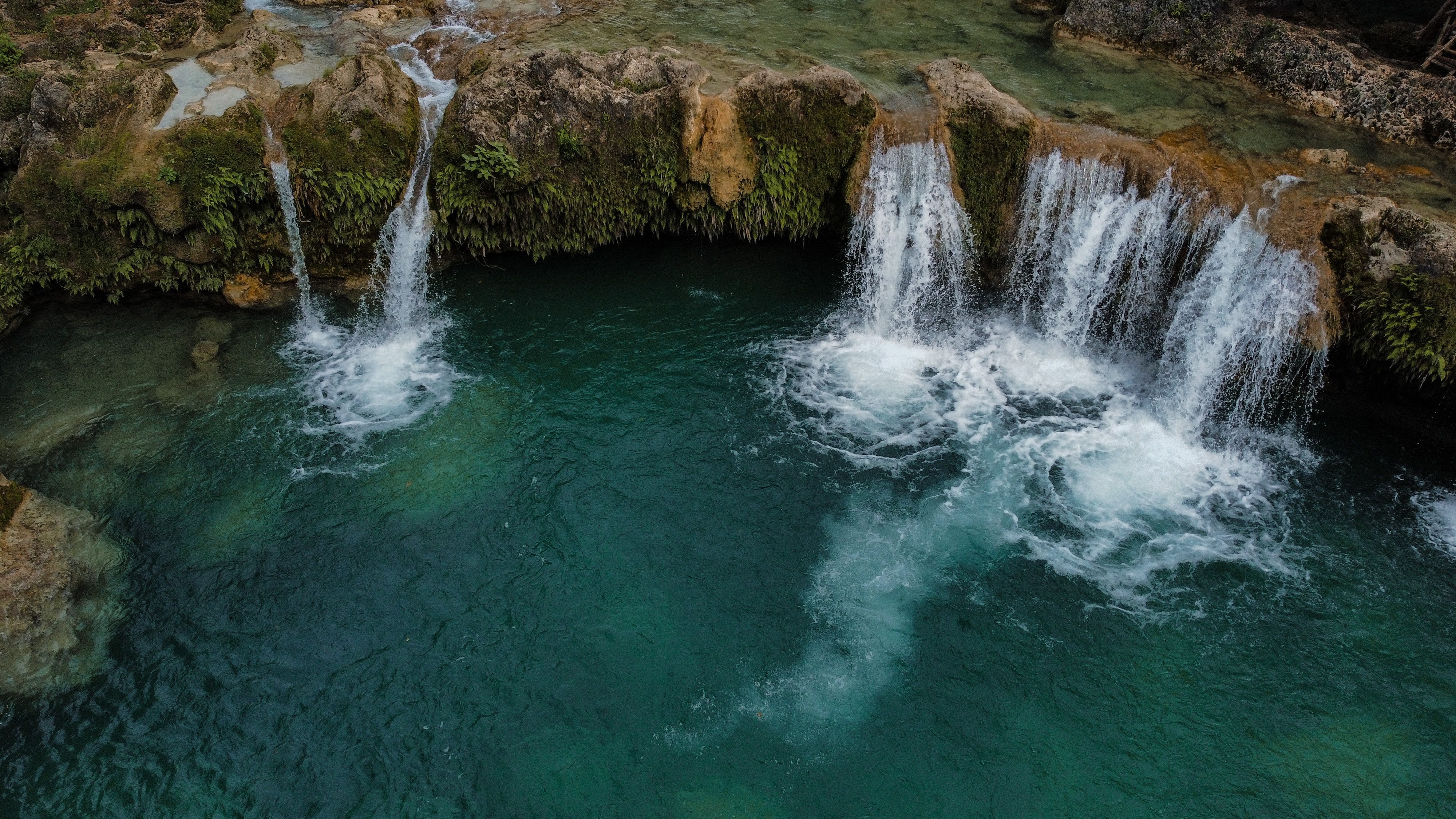 Stunning Aerial View of Serene Waterfalls · Free Stock Photo