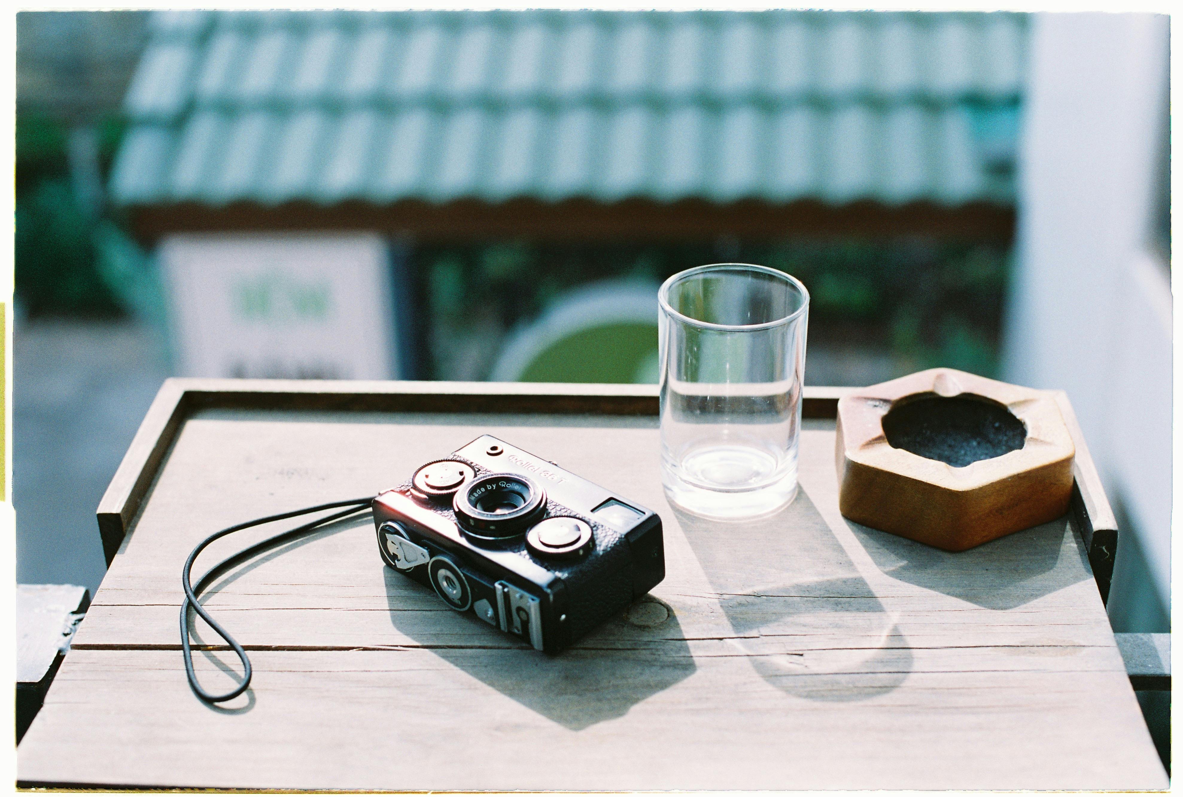 Camera, Glass and Ashtray · Free Stock Photo