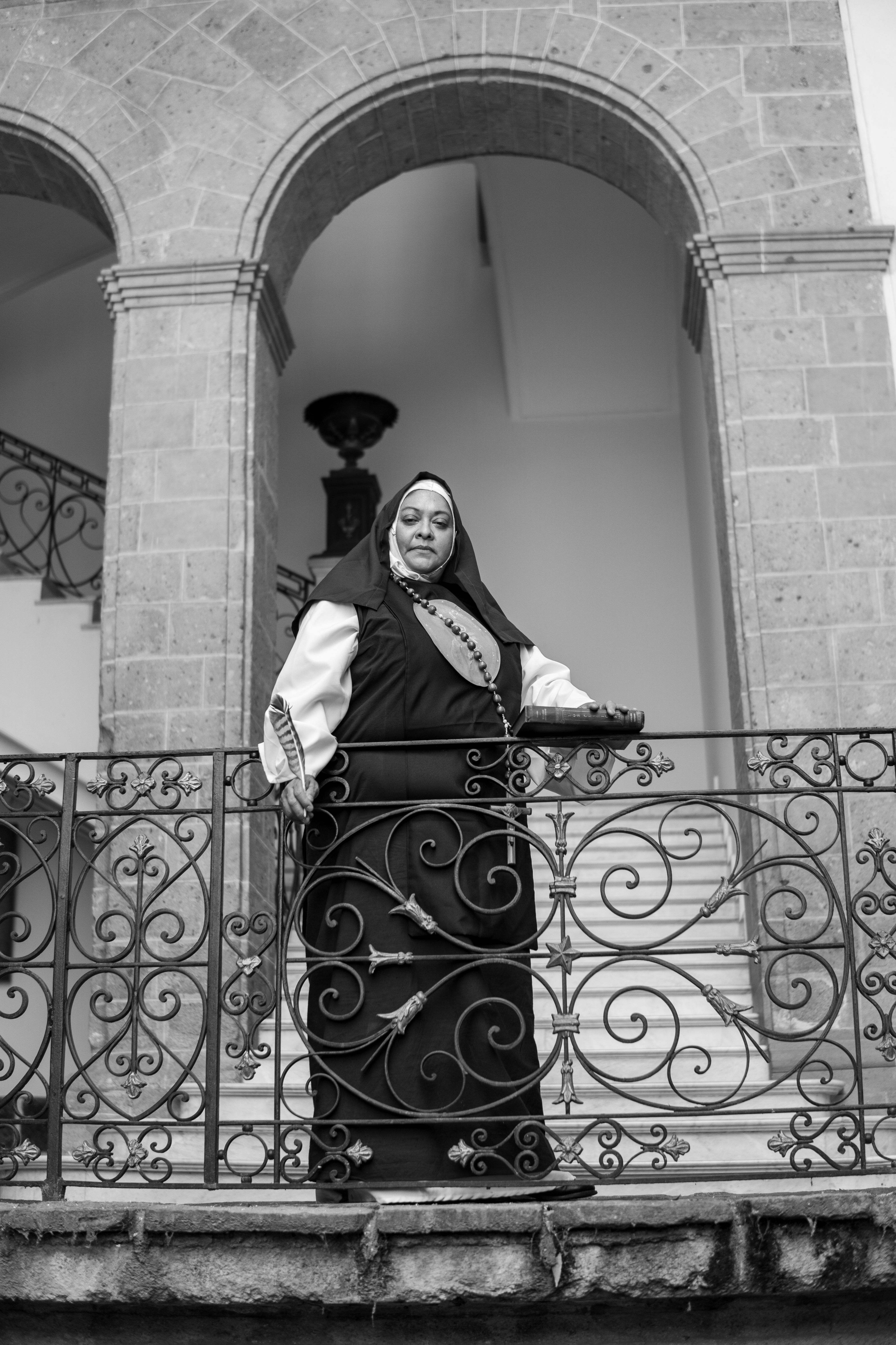 A Nun Standing in a Building · Free Stock Photo