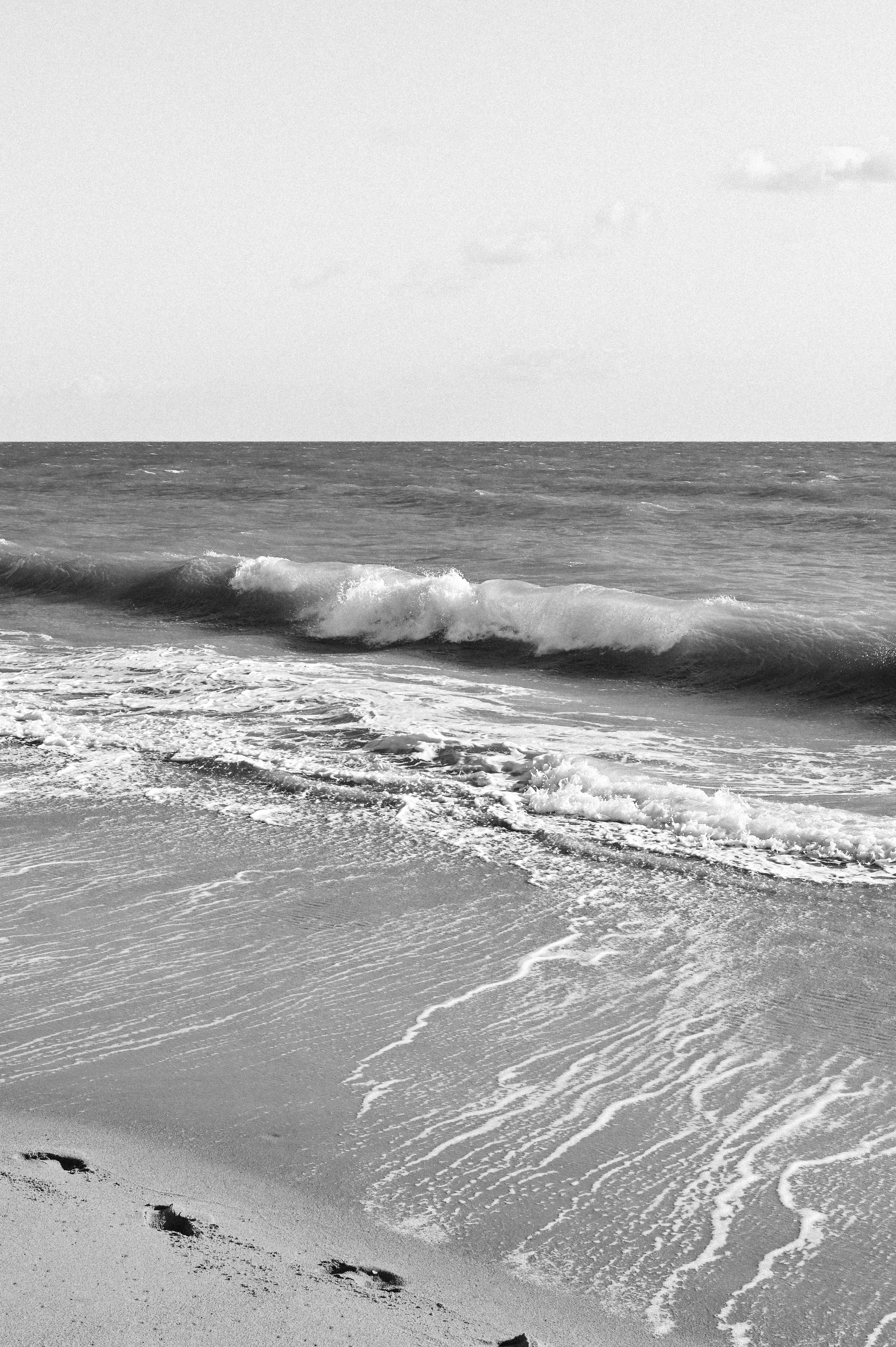 Black and White Photo of Waves Washing Up the Beach · Free Stock Photo