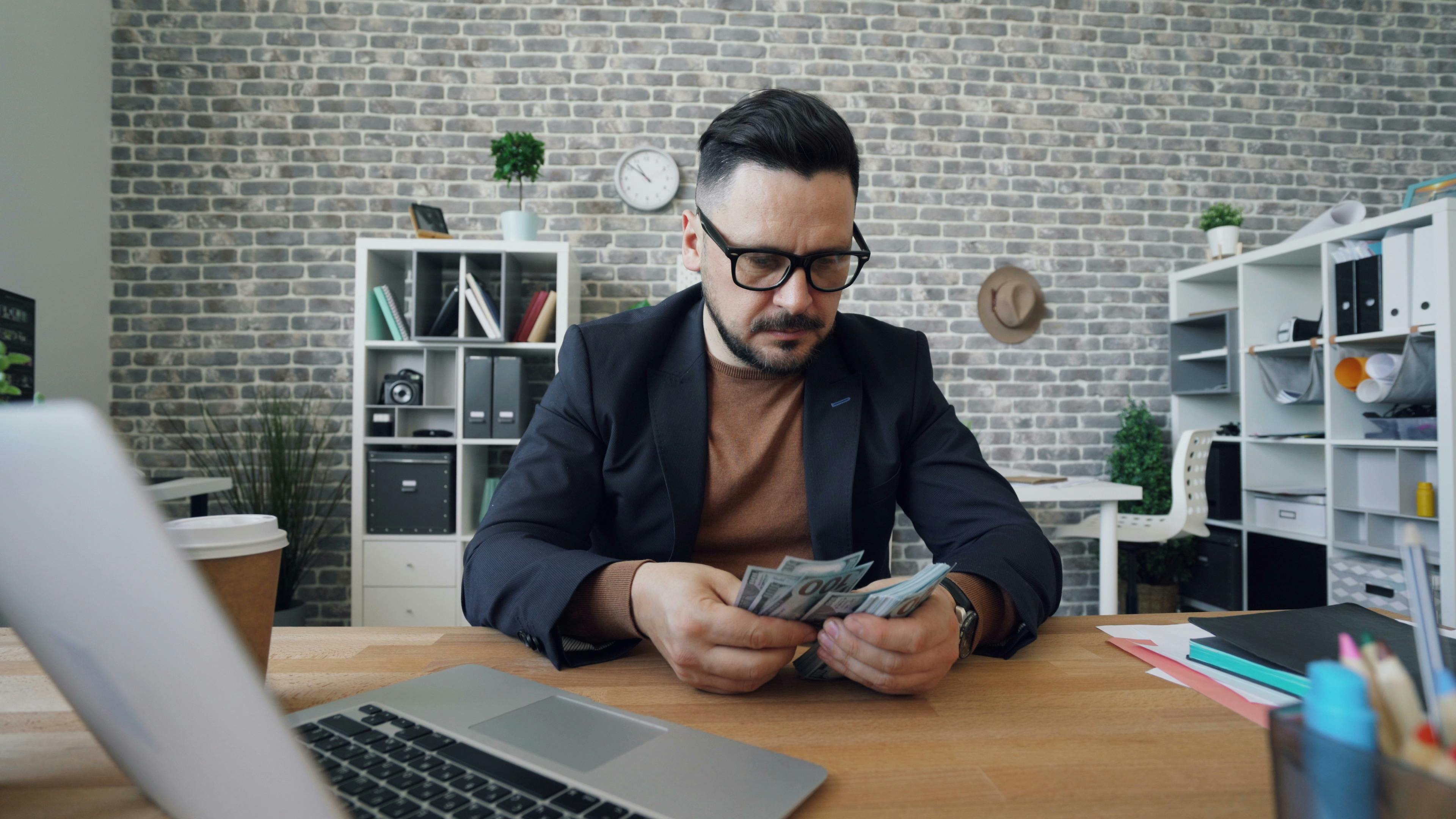 Happy Man Counting Money in Office · Free Stock Photo