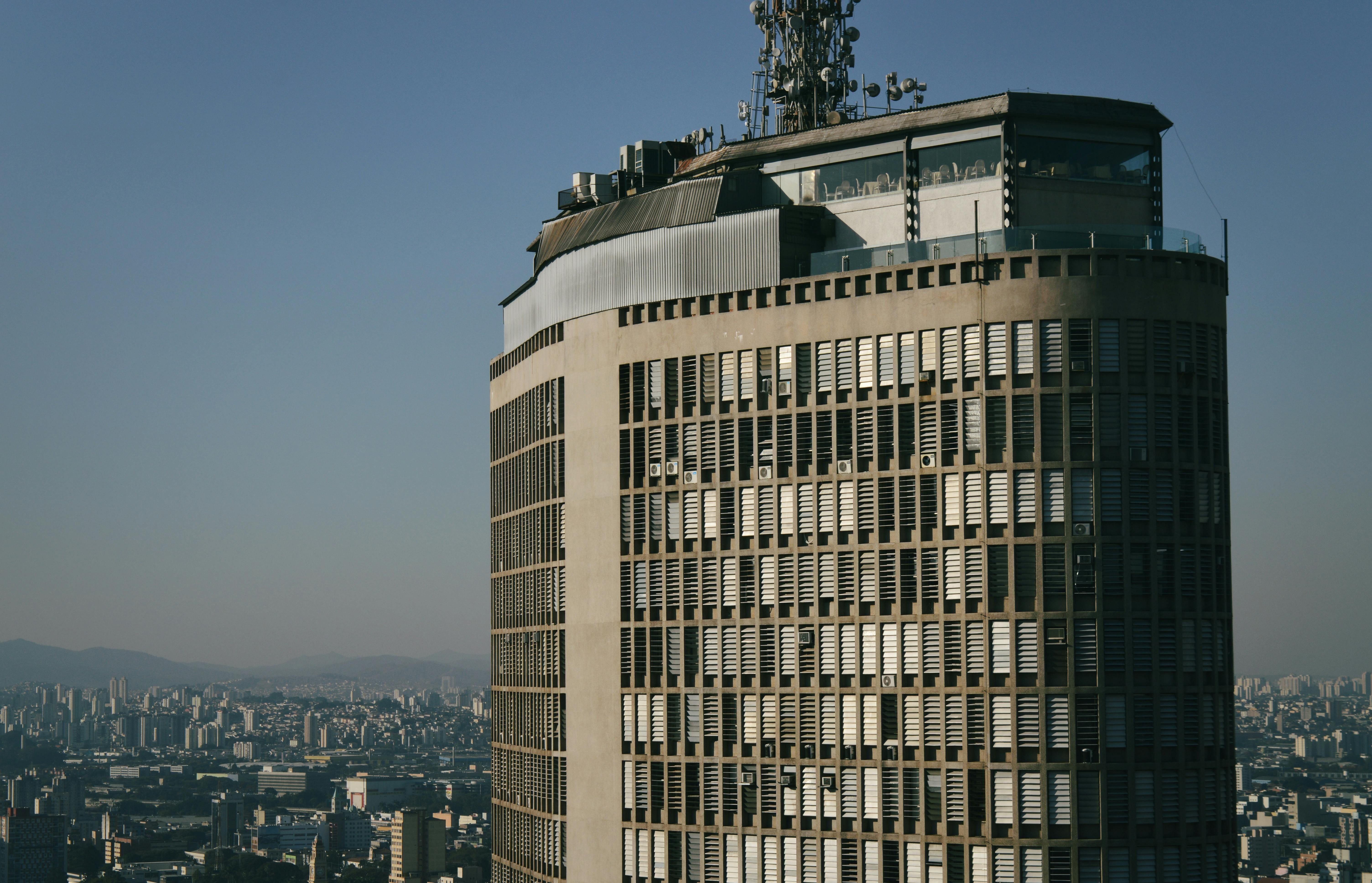 White and Red High-rise Building during Winter Season · Free Stock Photo