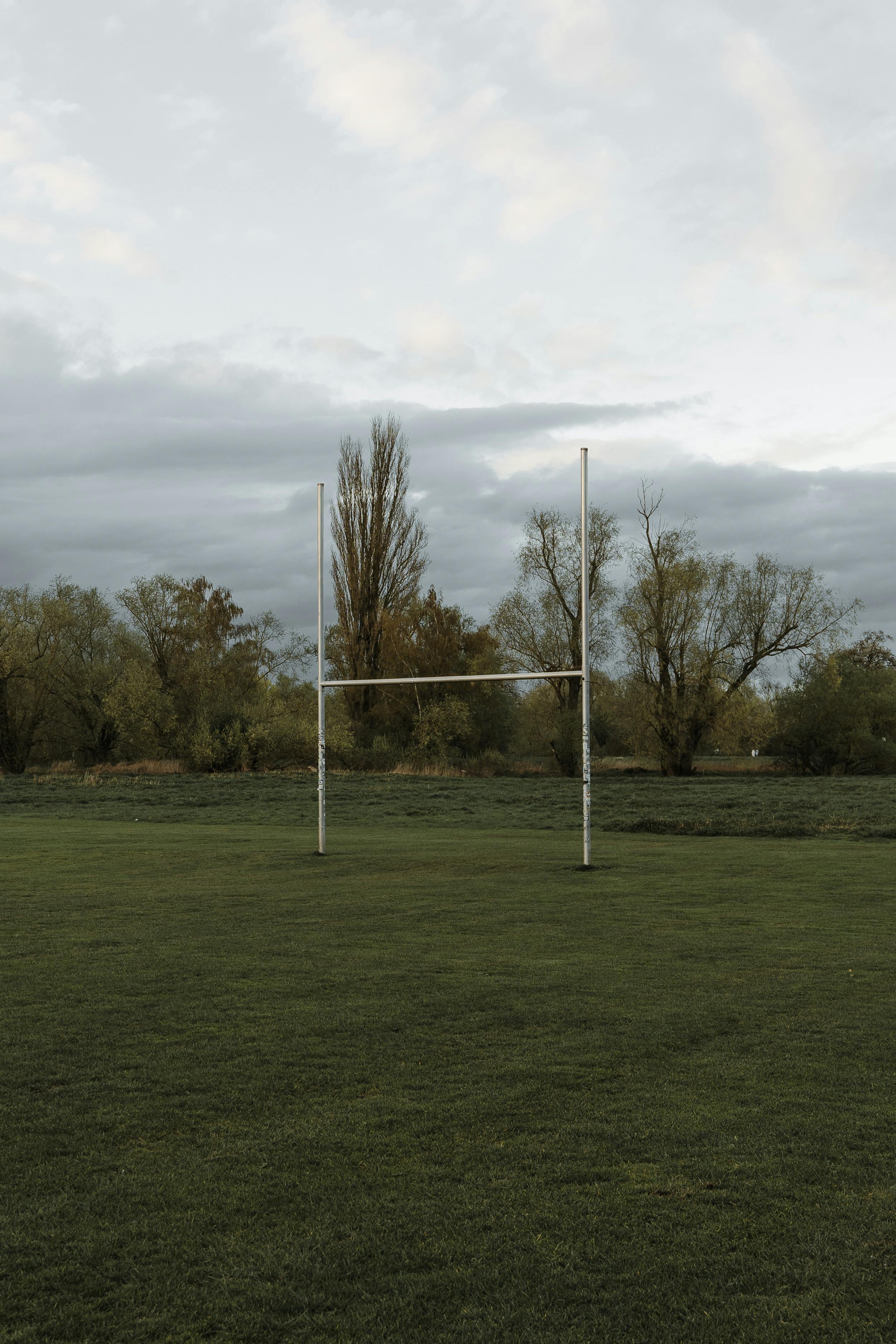 A rugby goal post in the middle of a field · Free Stock Photo