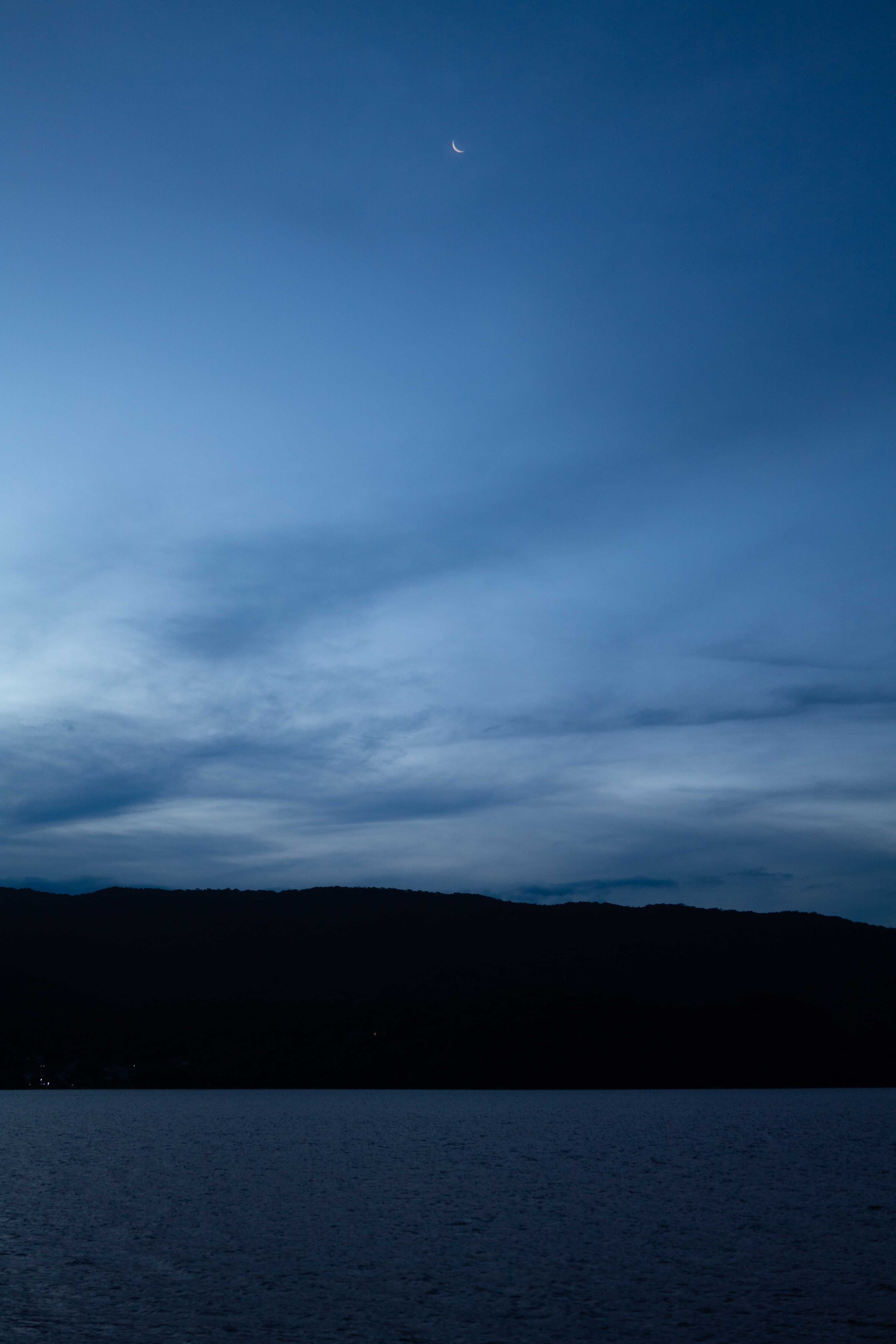 Crescent Moon over Hill at Dawn · Free Stock Photo