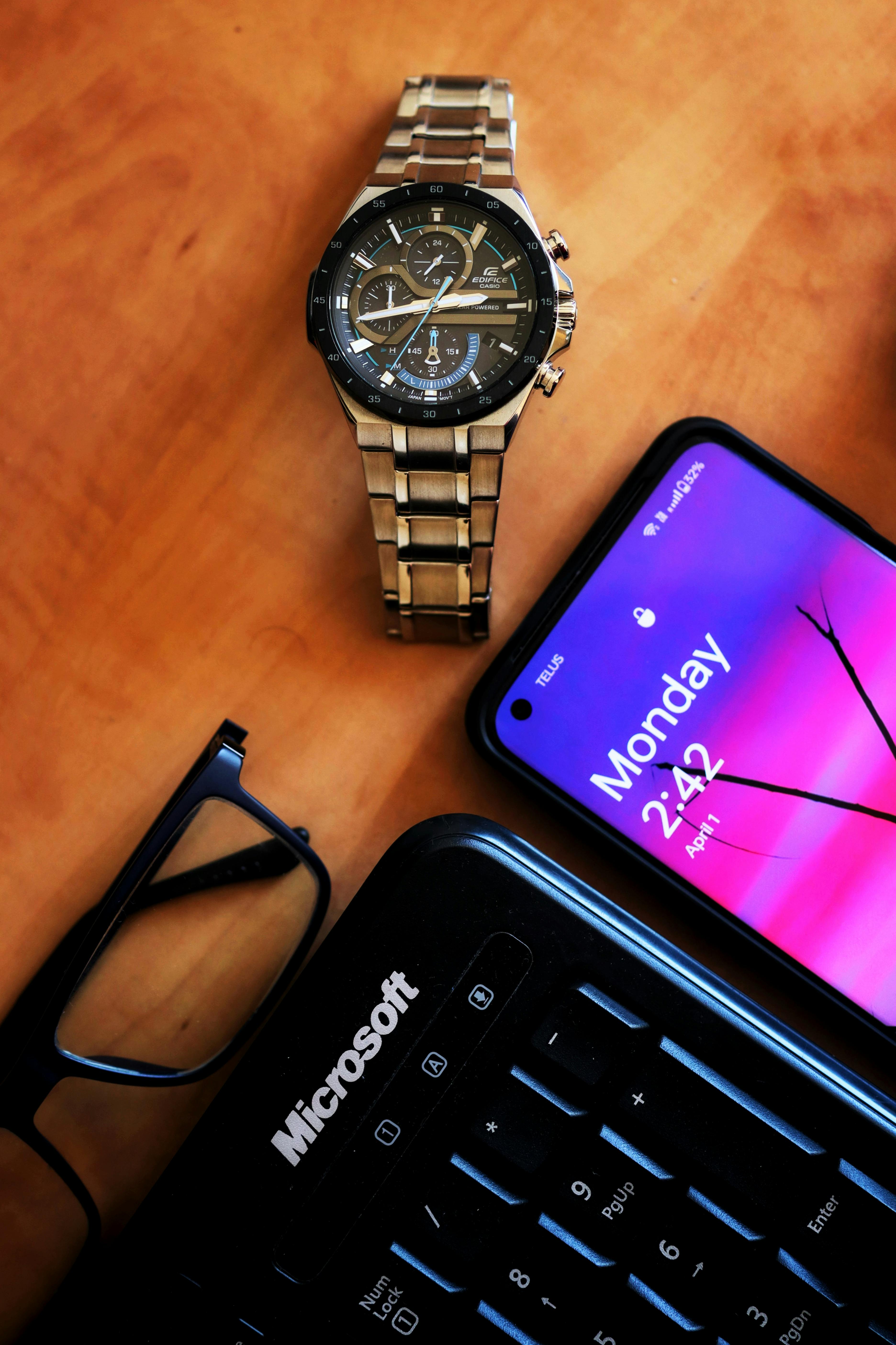 Wristwatch, Smartphone, Keyboard and Eyeglasse · Free Stock Photo