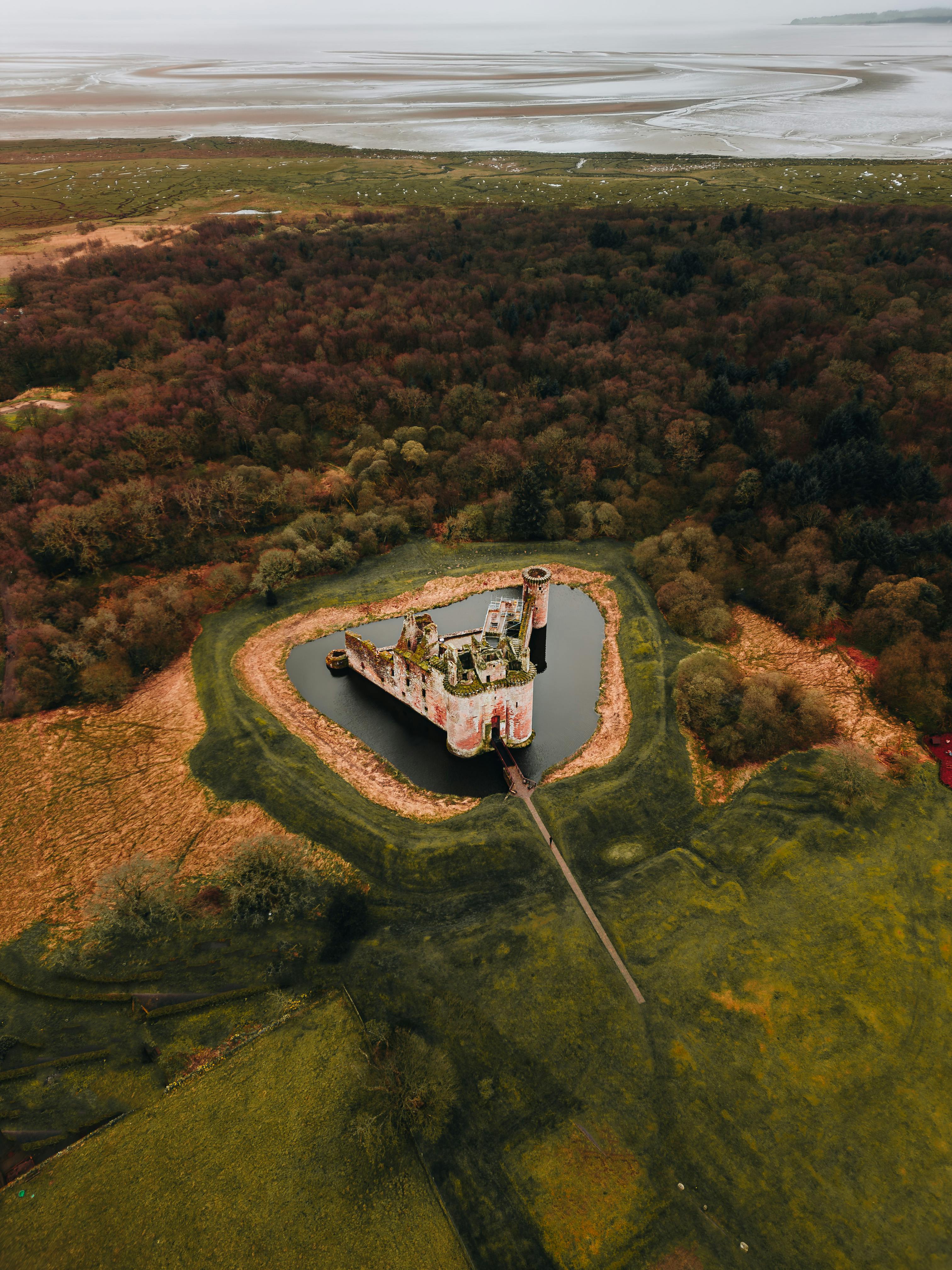 Castle with Moat in Forest · Free Stock Photo