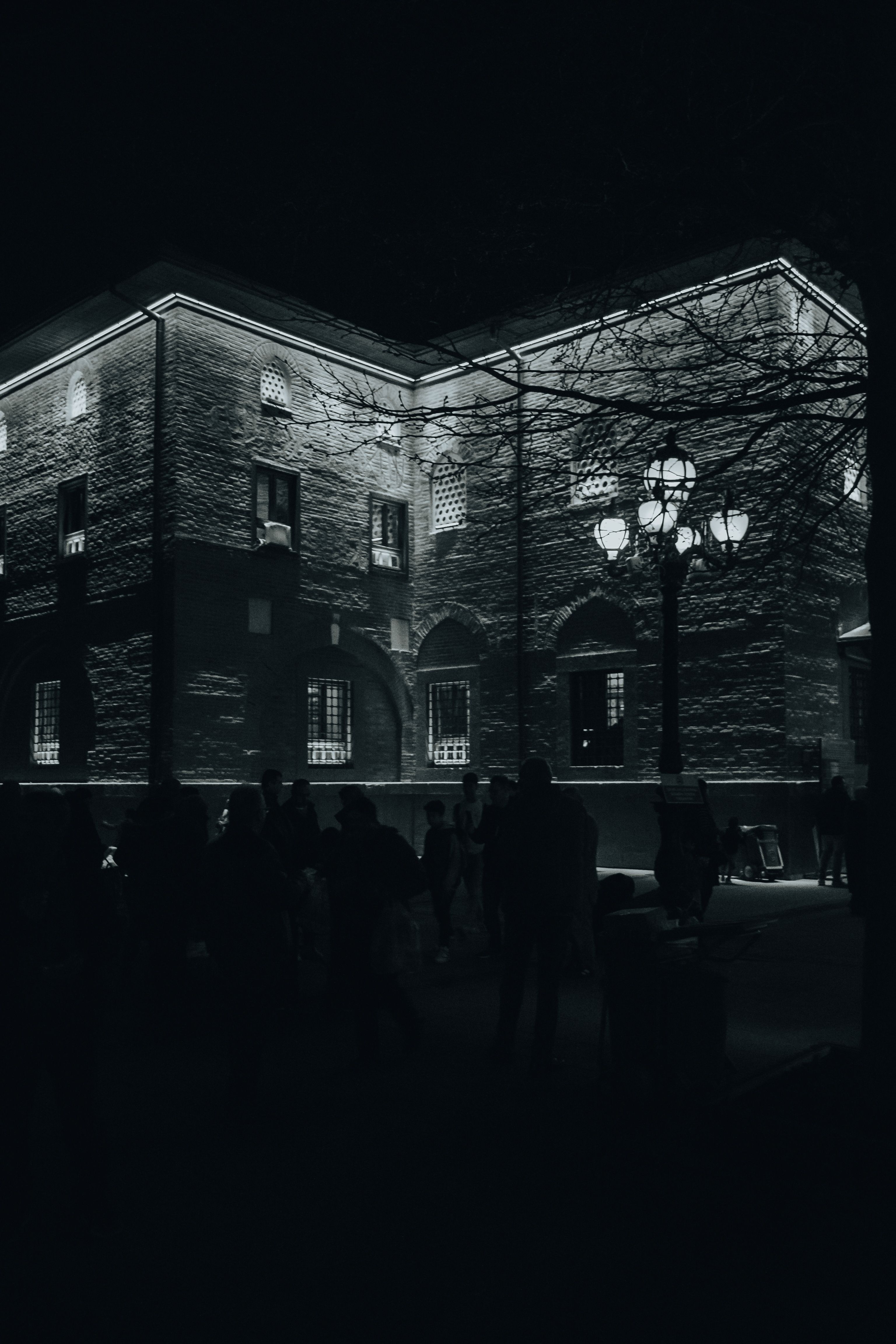 People and Building in Darkness at Night · Free Stock Photo