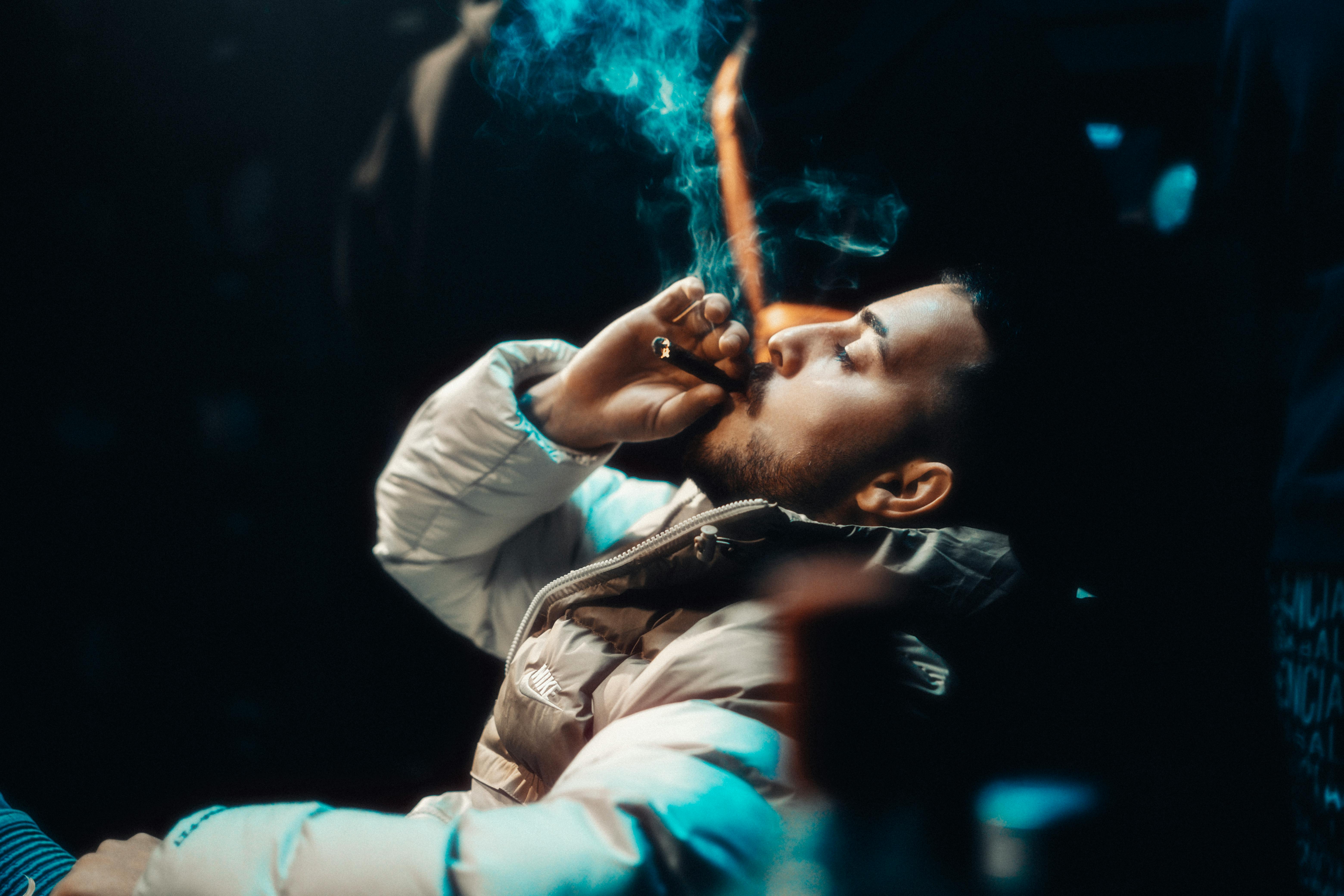 Portrait of a Man Smoking a Cigar · Free Stock Photo
