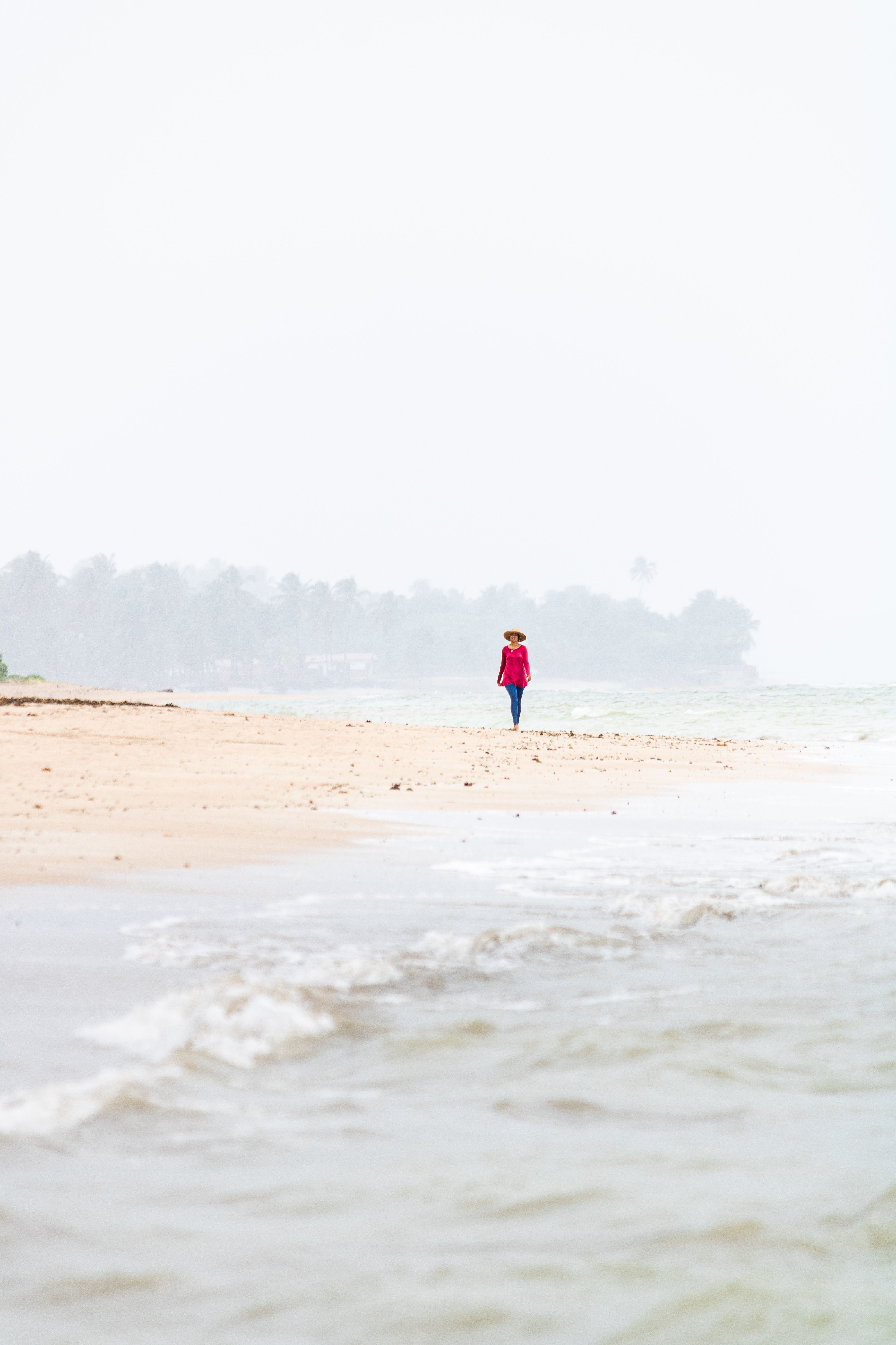 Faceless man walking on grassy hill · Free Stock Photo