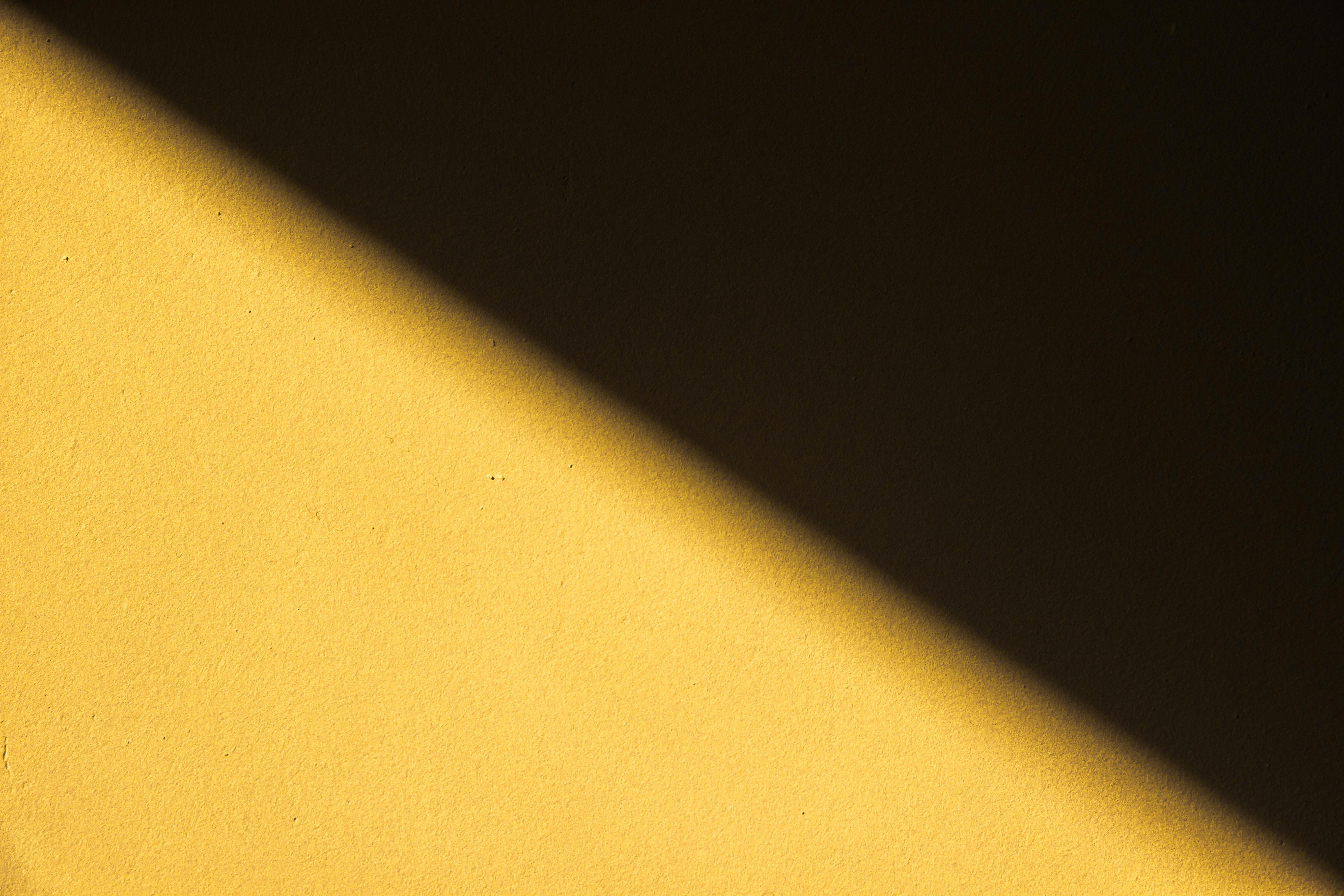 Yellow Wall With A Shadow · Free Stock Photo