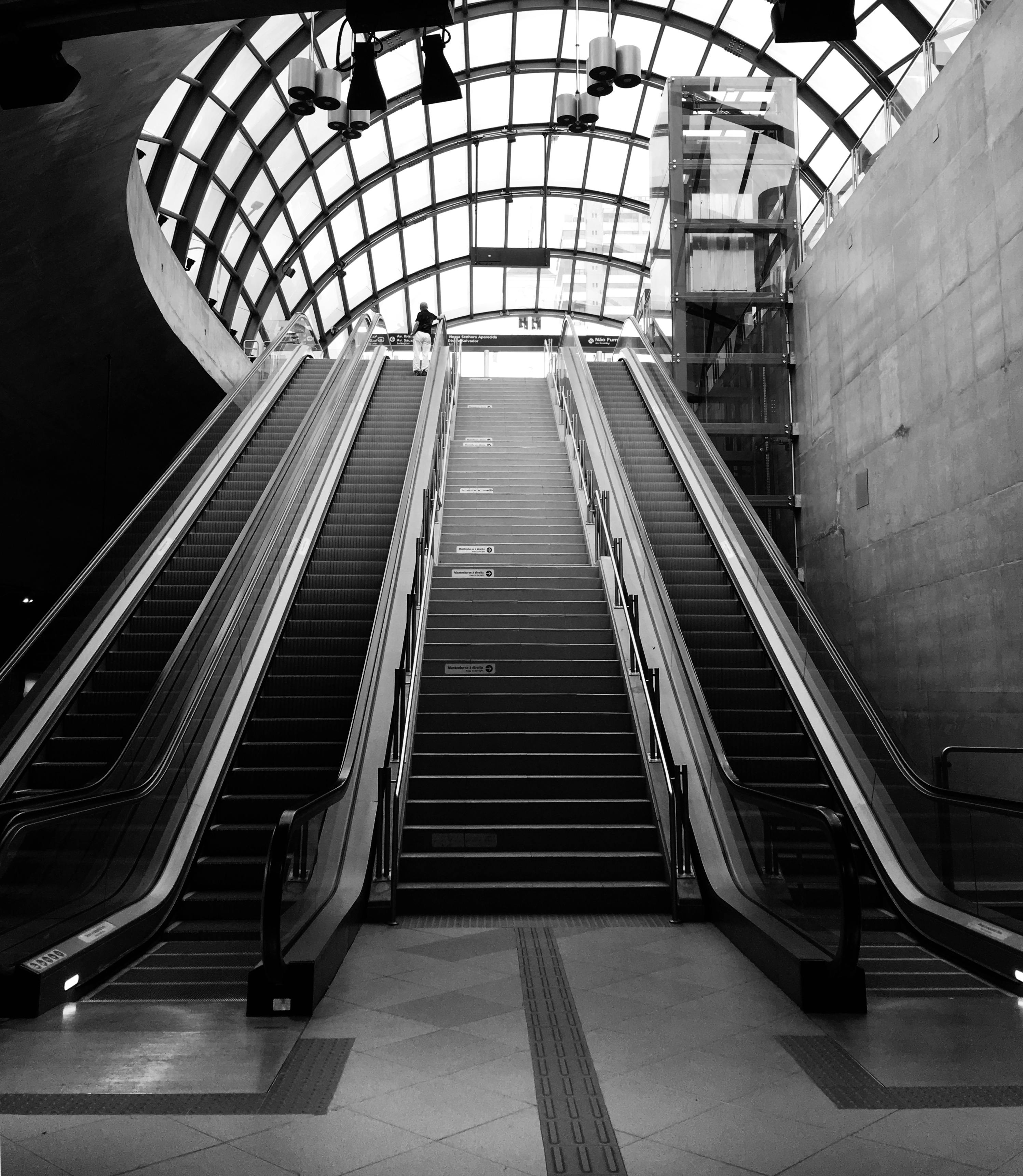 Grayscale Photo Of Escalators · Free Stock Photo