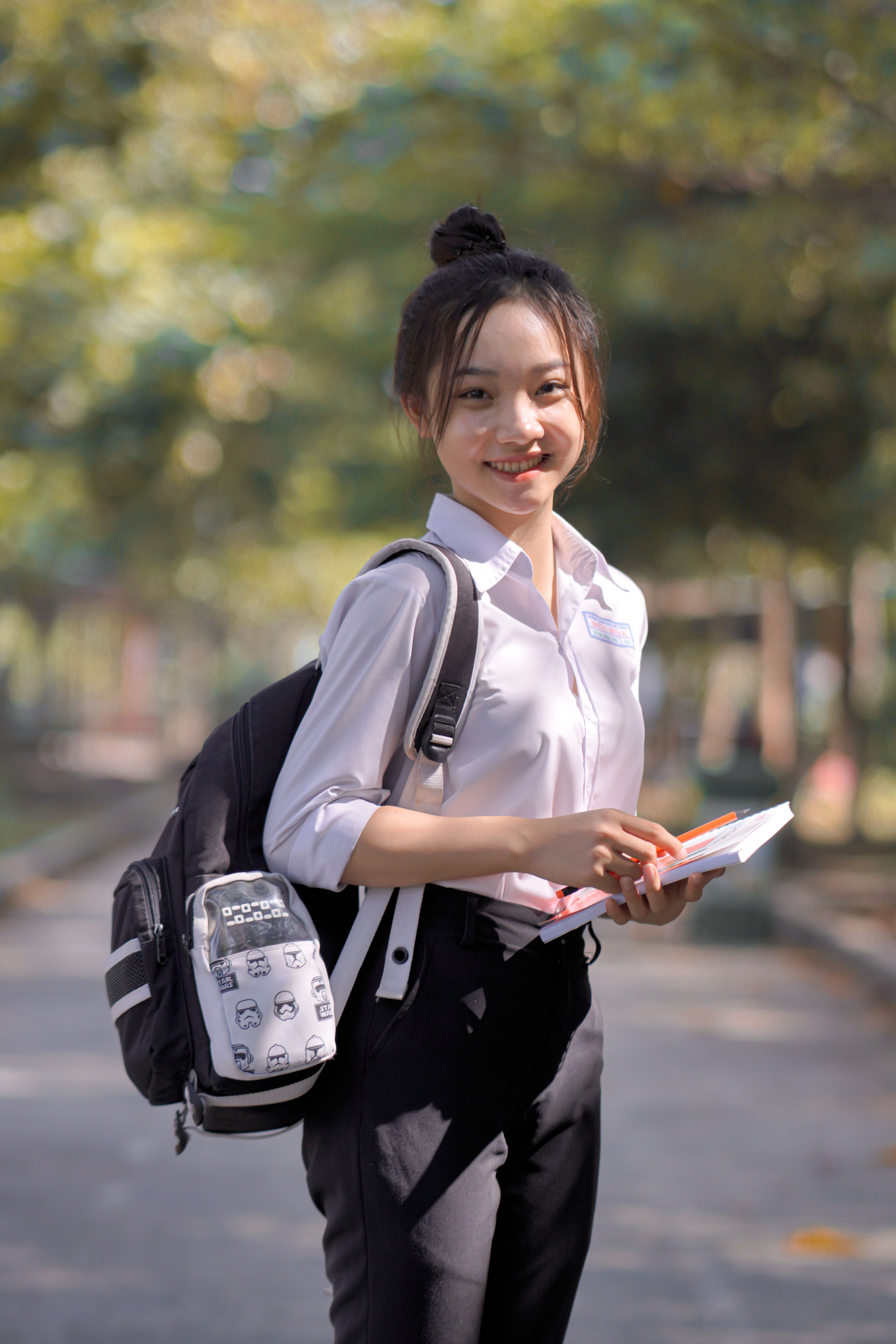 Portrait of Girl Wearing Uniform and Backpack · Free Stock Photo