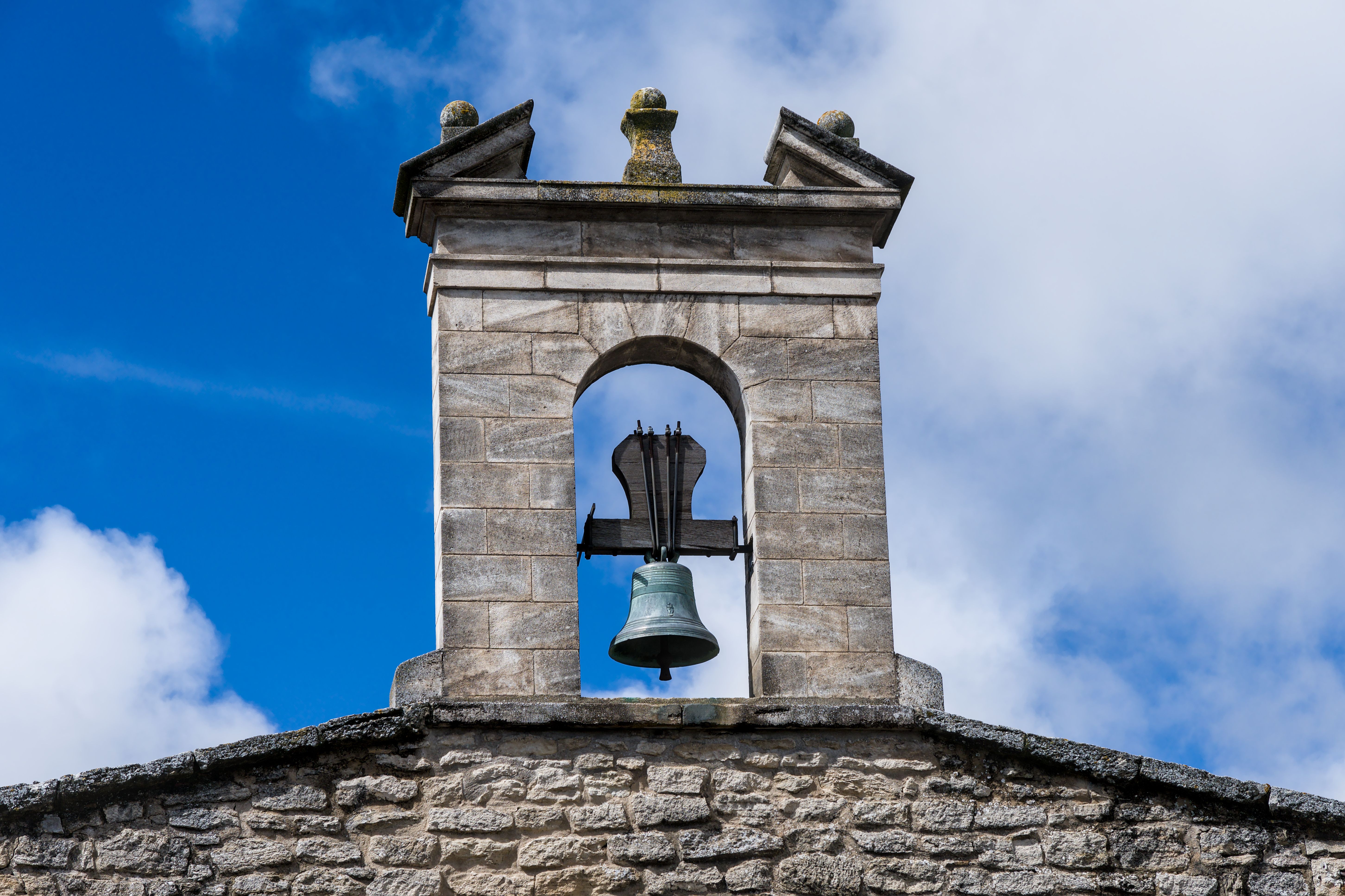 Bell on Stone Church Wall · Free Stock Photo