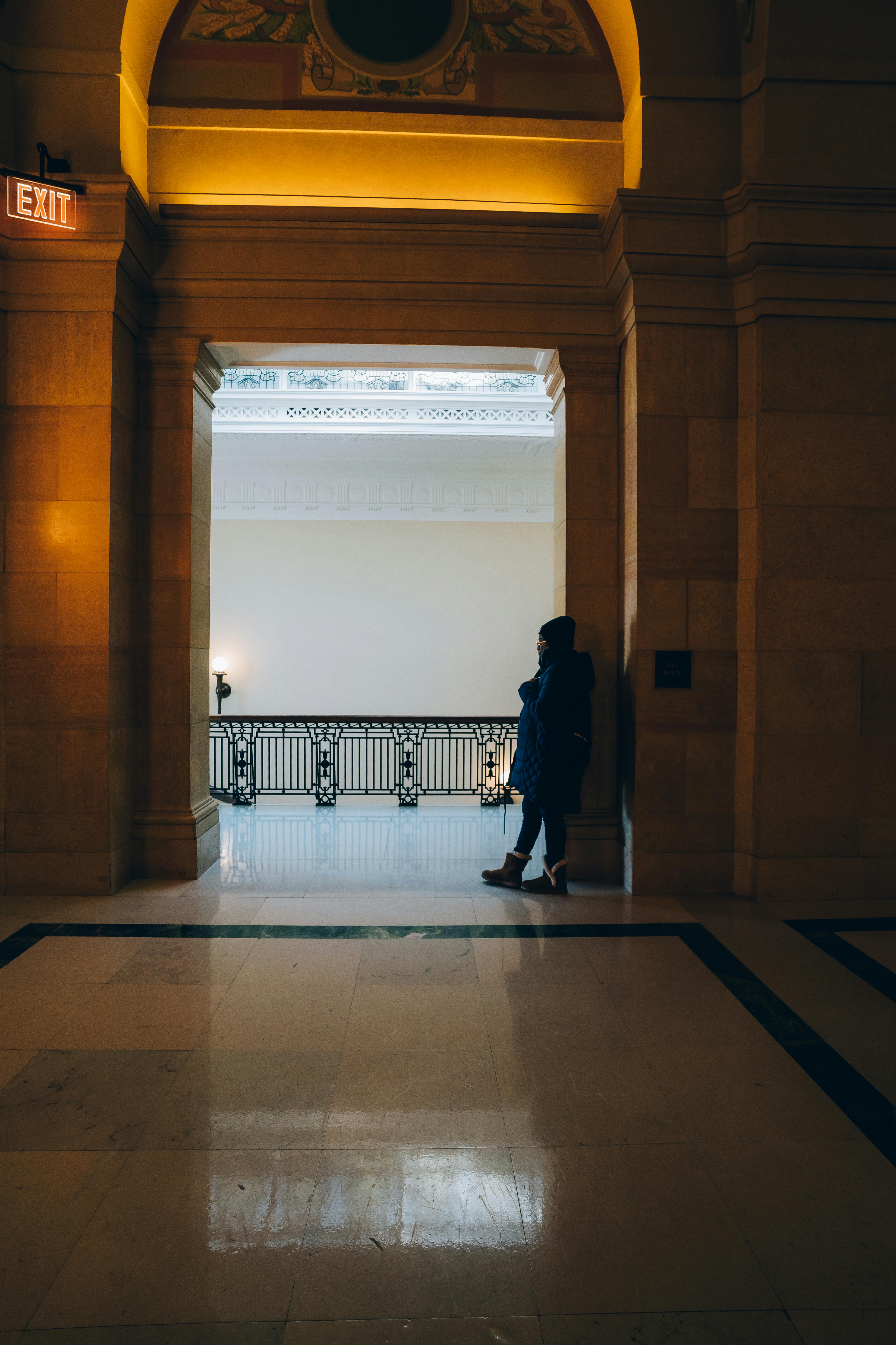 Person Leaning on Wall · Free Stock Photo