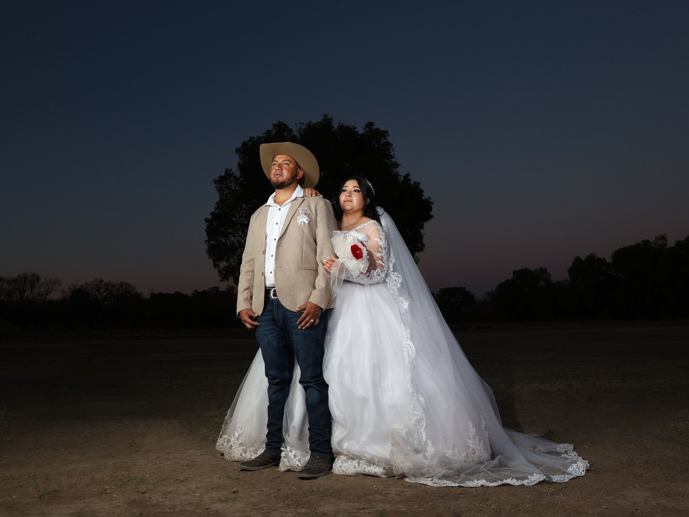 Newlyweds in Wedding Dress and Suit Jacket with Cowboy Hat in ...