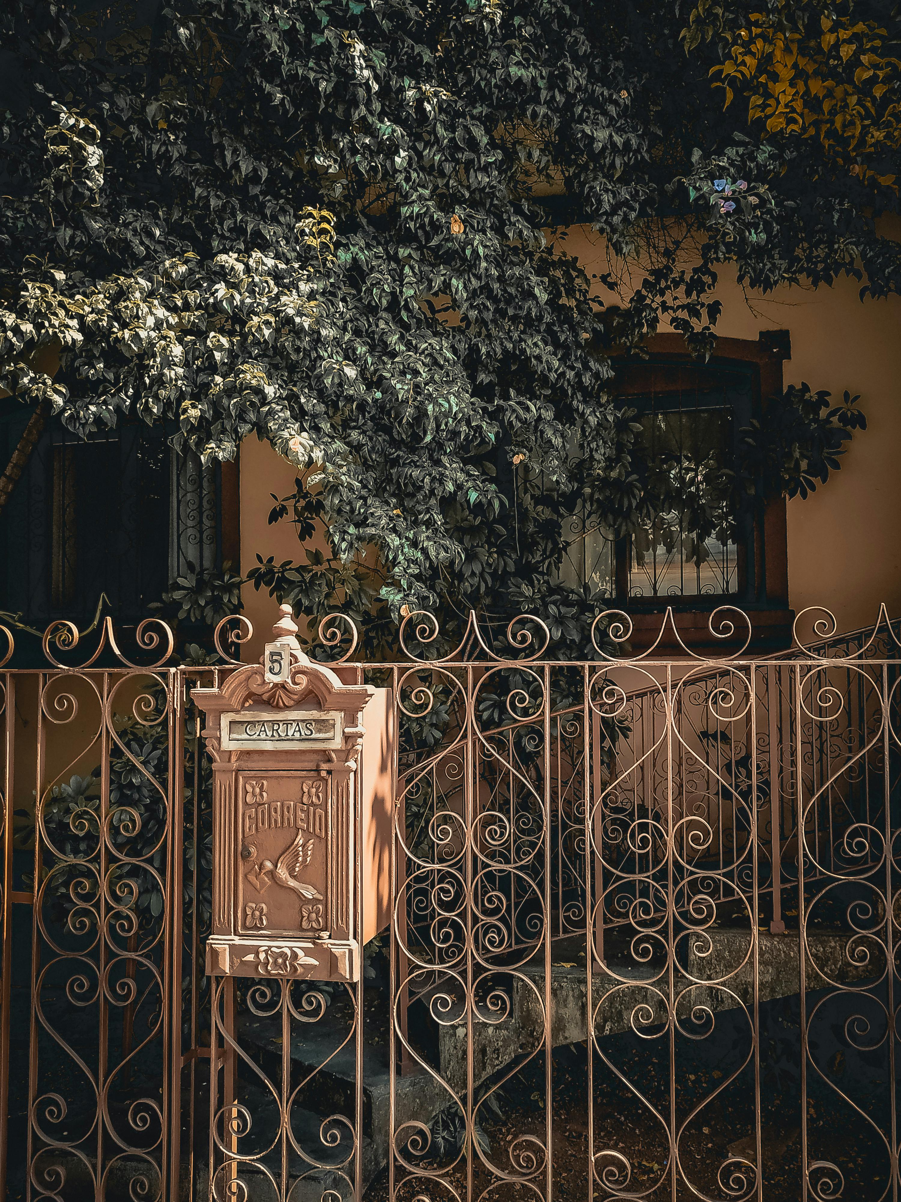 Brown Mailbox on Brown Metal Gate · Free Stock Photo