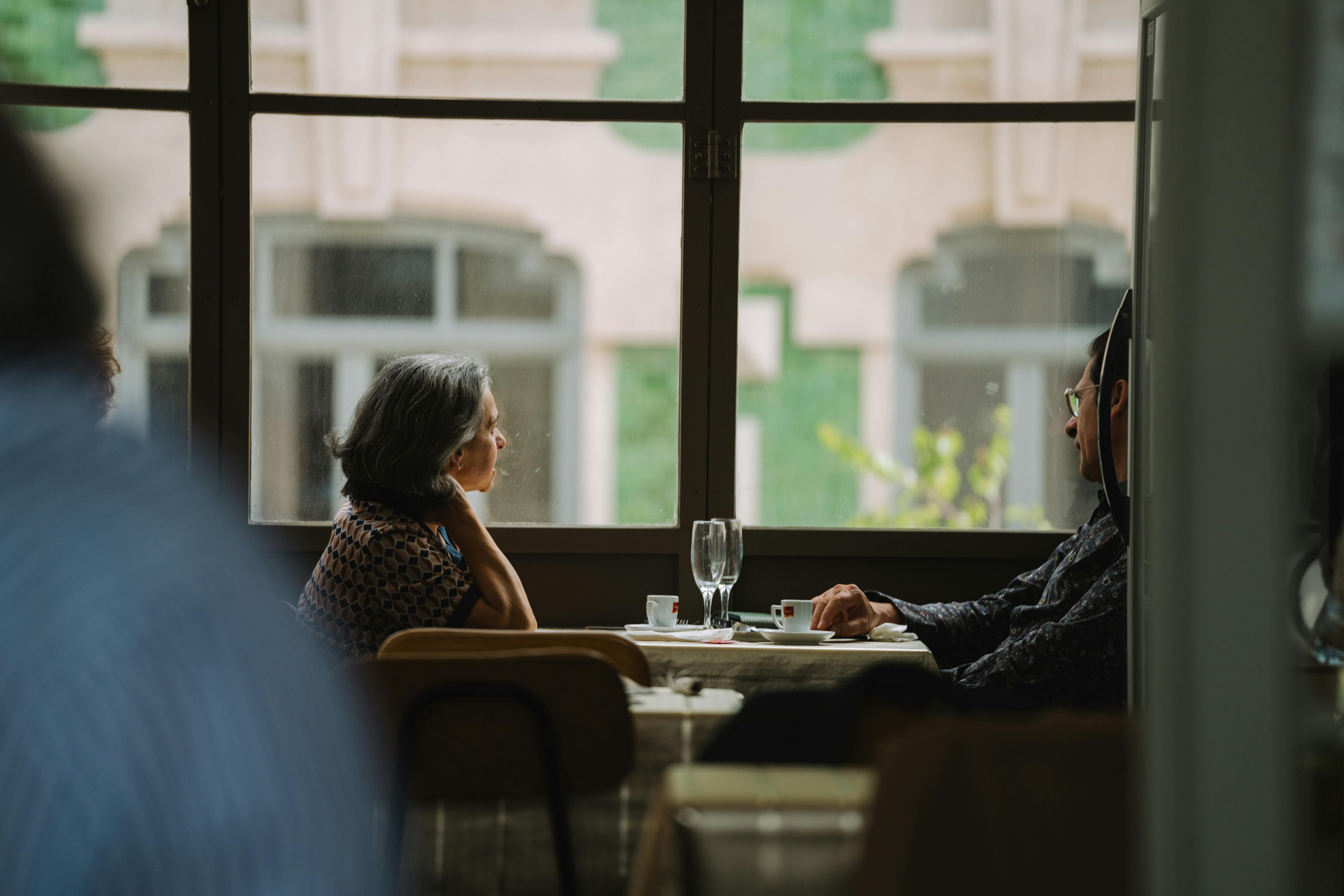 Elderly Couple Sitting at Restaurant · Free Stock Photo