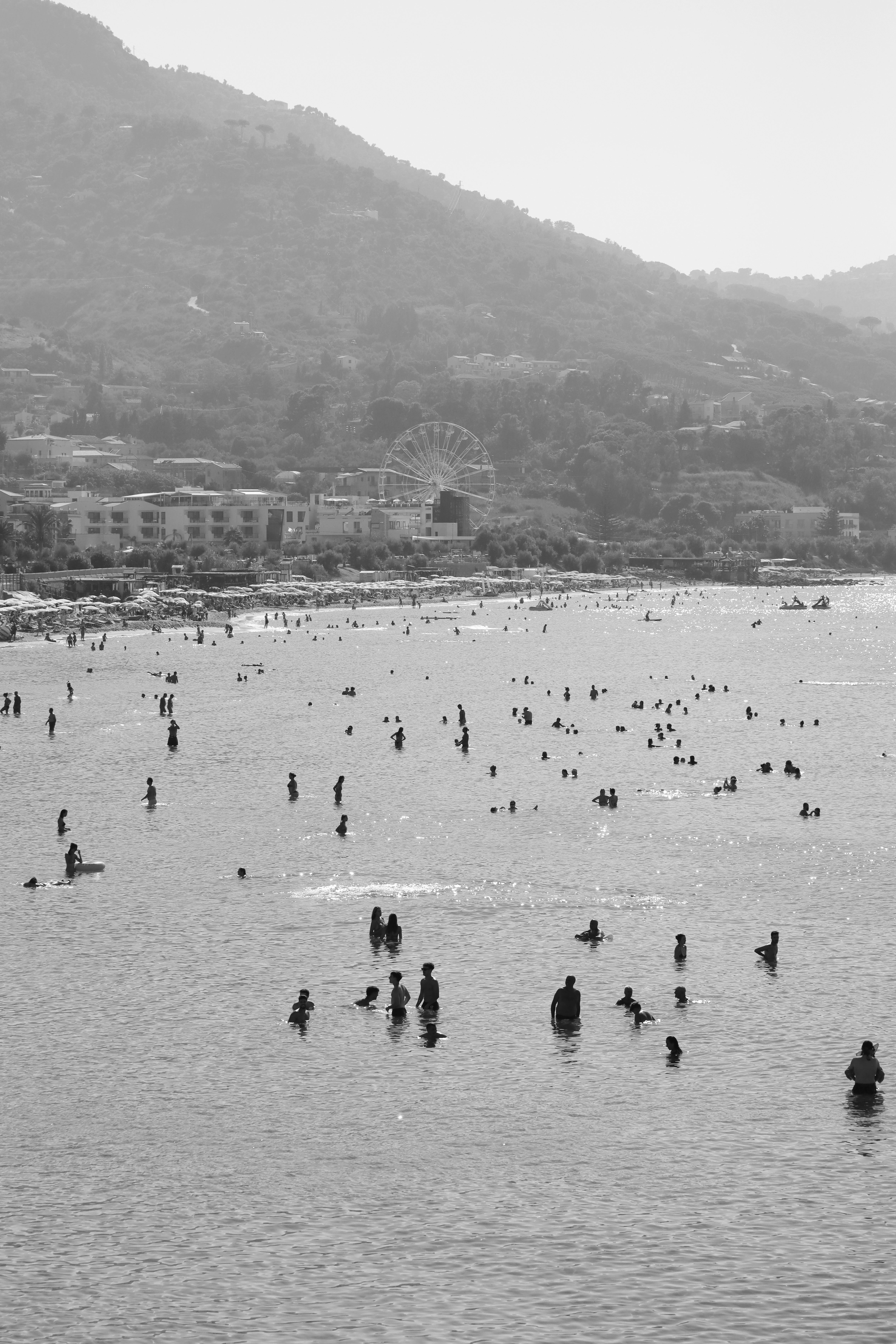 Bathers in the Sea by a Seashore by a Mountain in Black and White ...