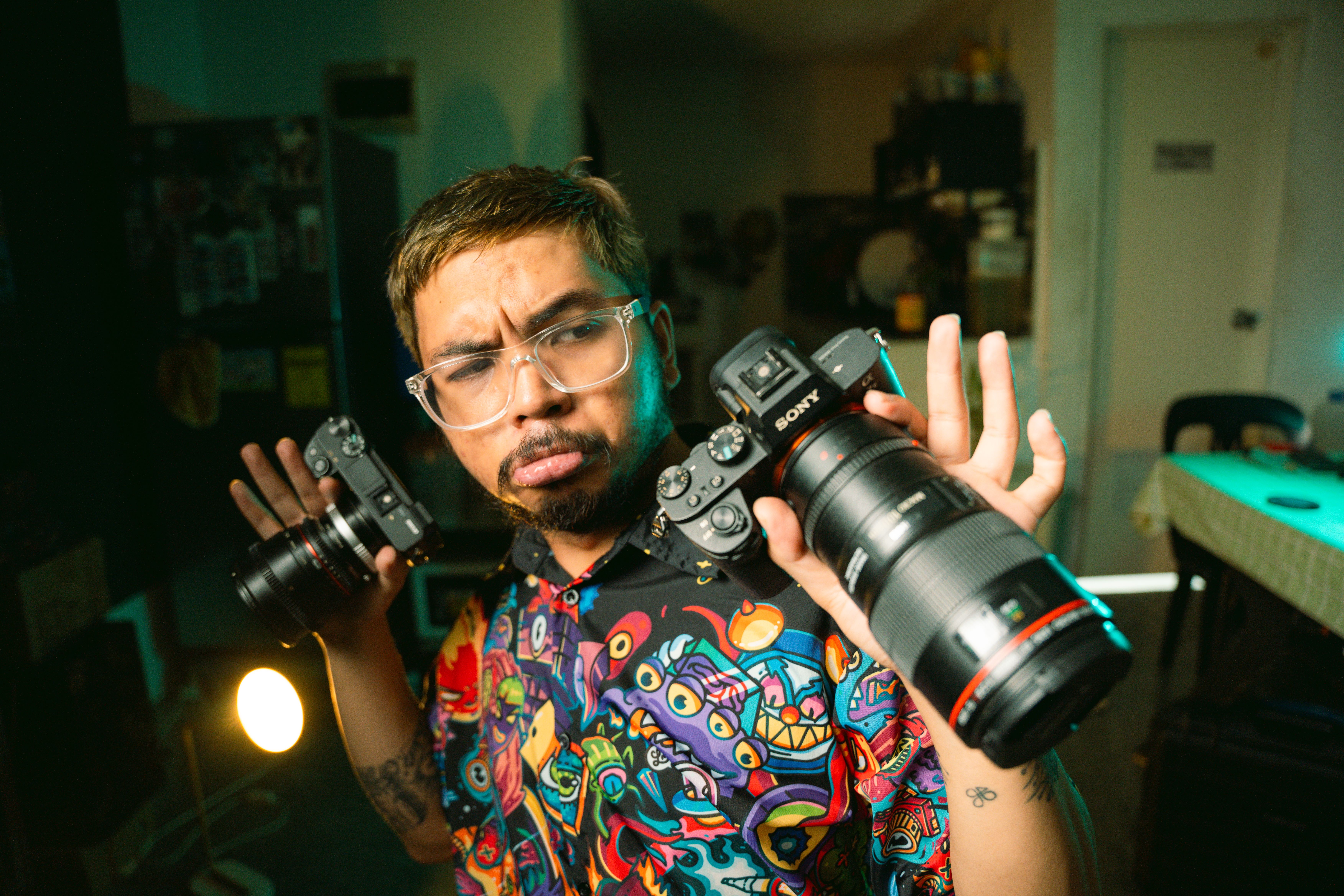 Blonde Man in Eyeglasses and with Cameras · Free Stock Photo