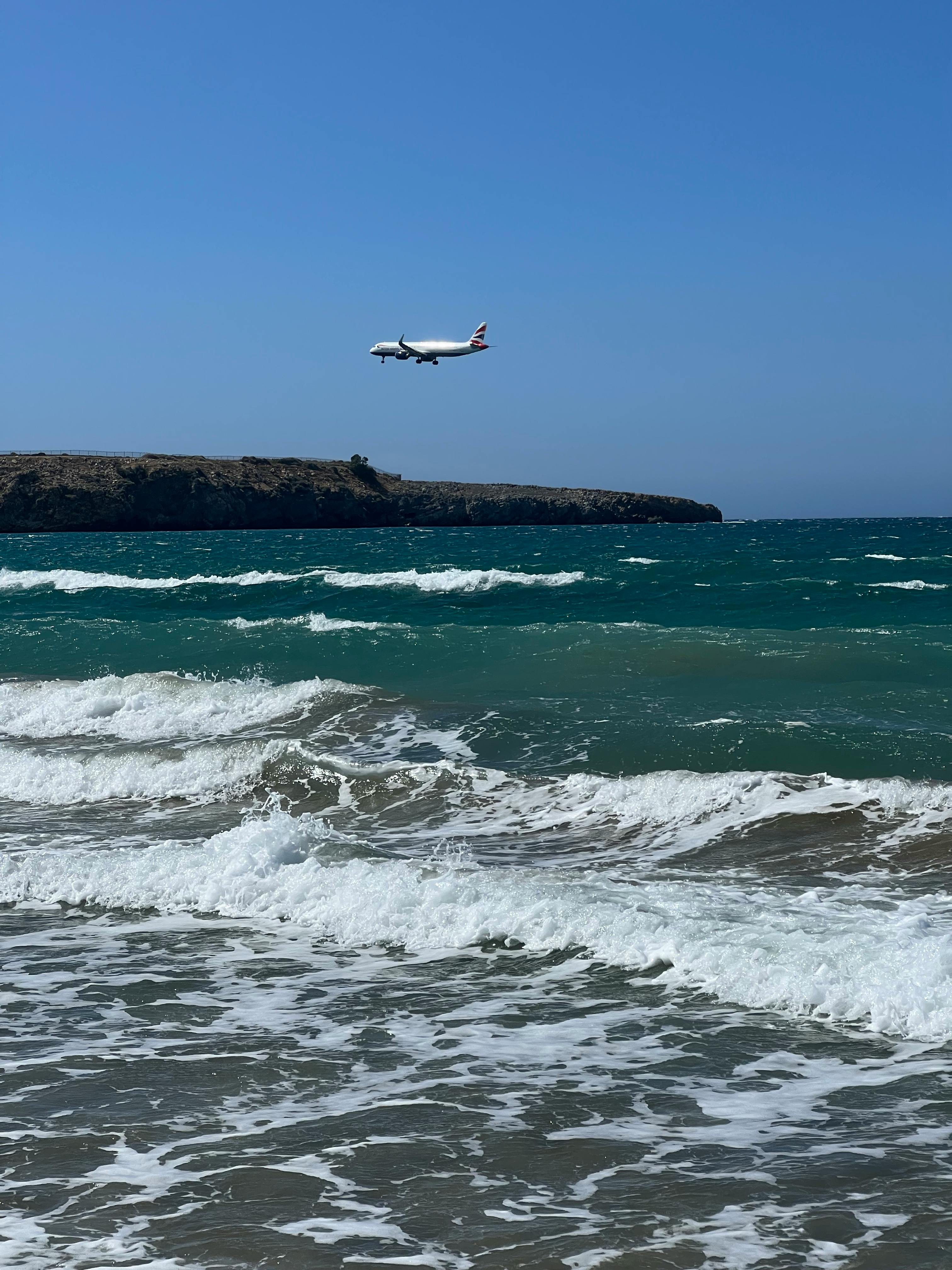 Commercial Airplane Flying Low over the Sea · Free Stock Photo